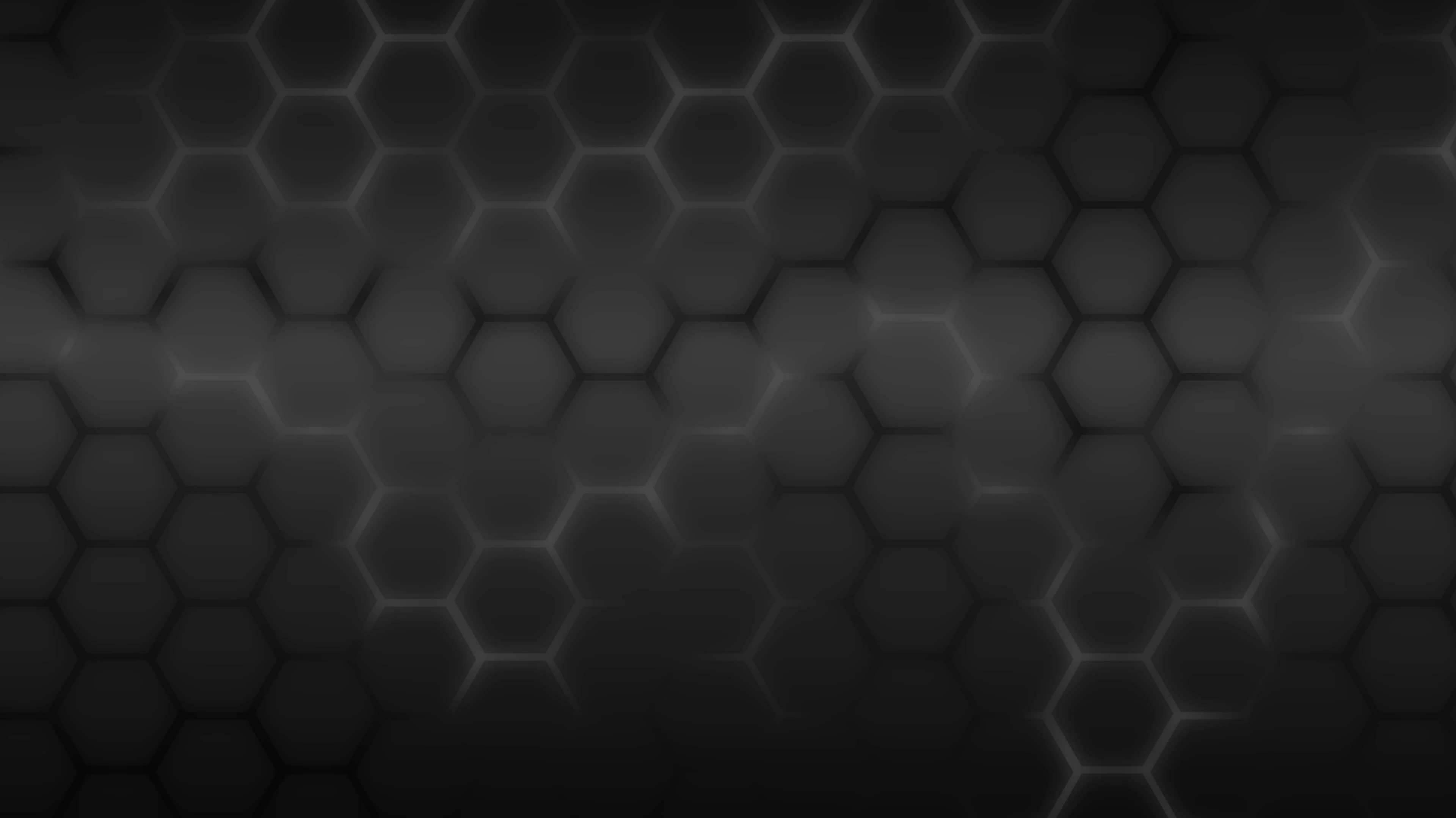 Gray hexagonal background in carbon optic pulsating with dark gradient background as zooming ...