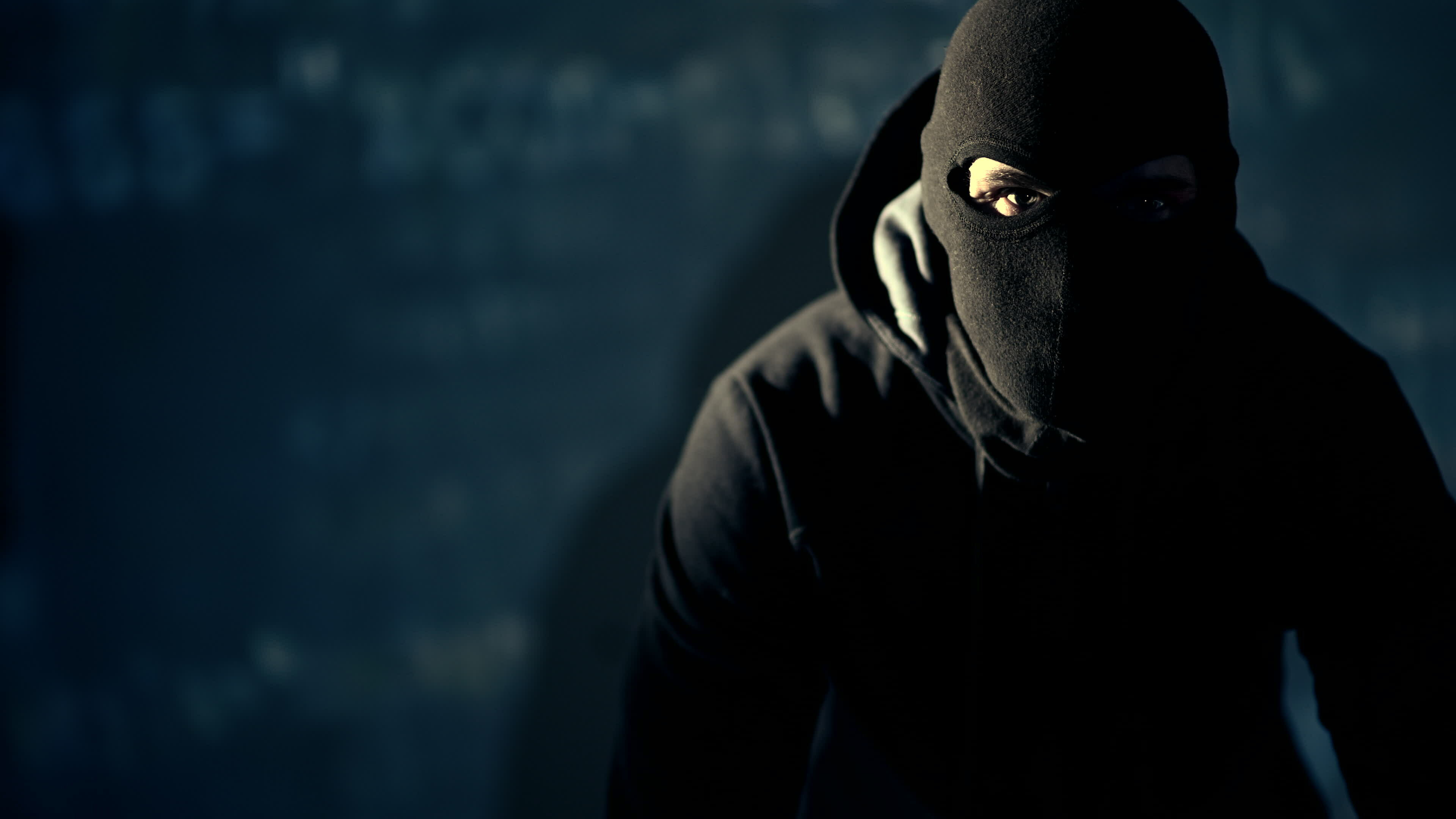 Cyber Security Concept with Masked Caucasian Men and Running Codes in ...