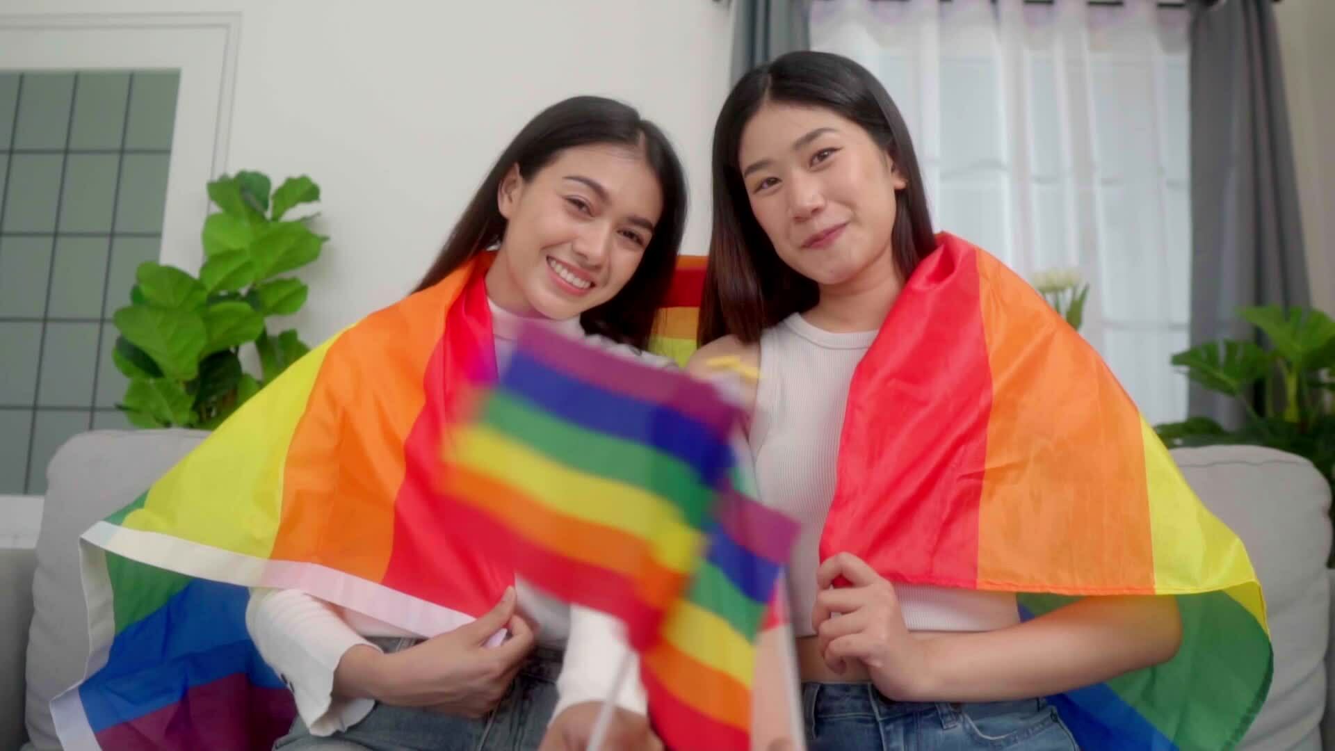Asian young beautiful pretty female lesbian sitting down and sofa flag ... Asian young beautiful pretty female lesbian sitting down and sofa flag ...