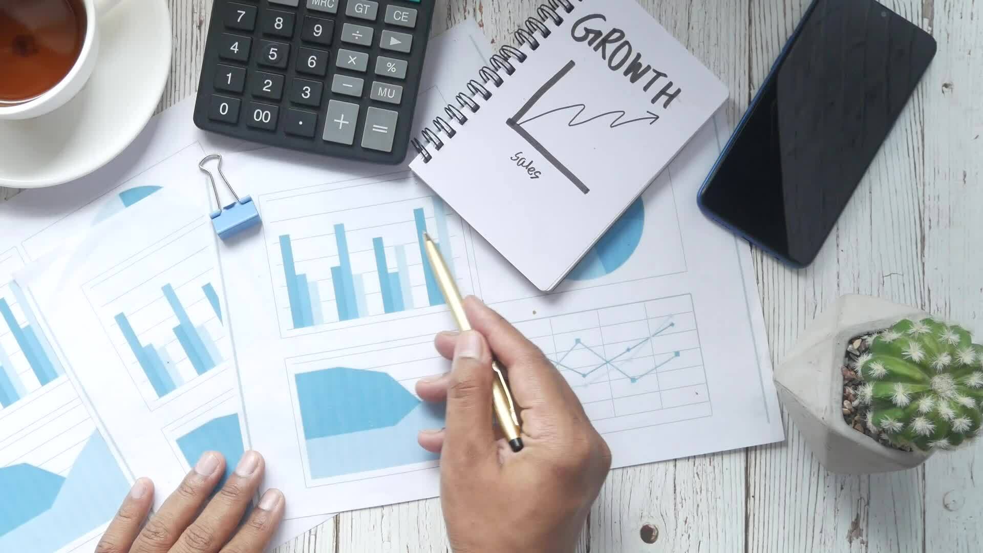 man hand with pen analyzing bar chart on paper 26456660 Stock Video at ... man hand with pen analyzing bar chart on paper 26456660 Stock Video at ...