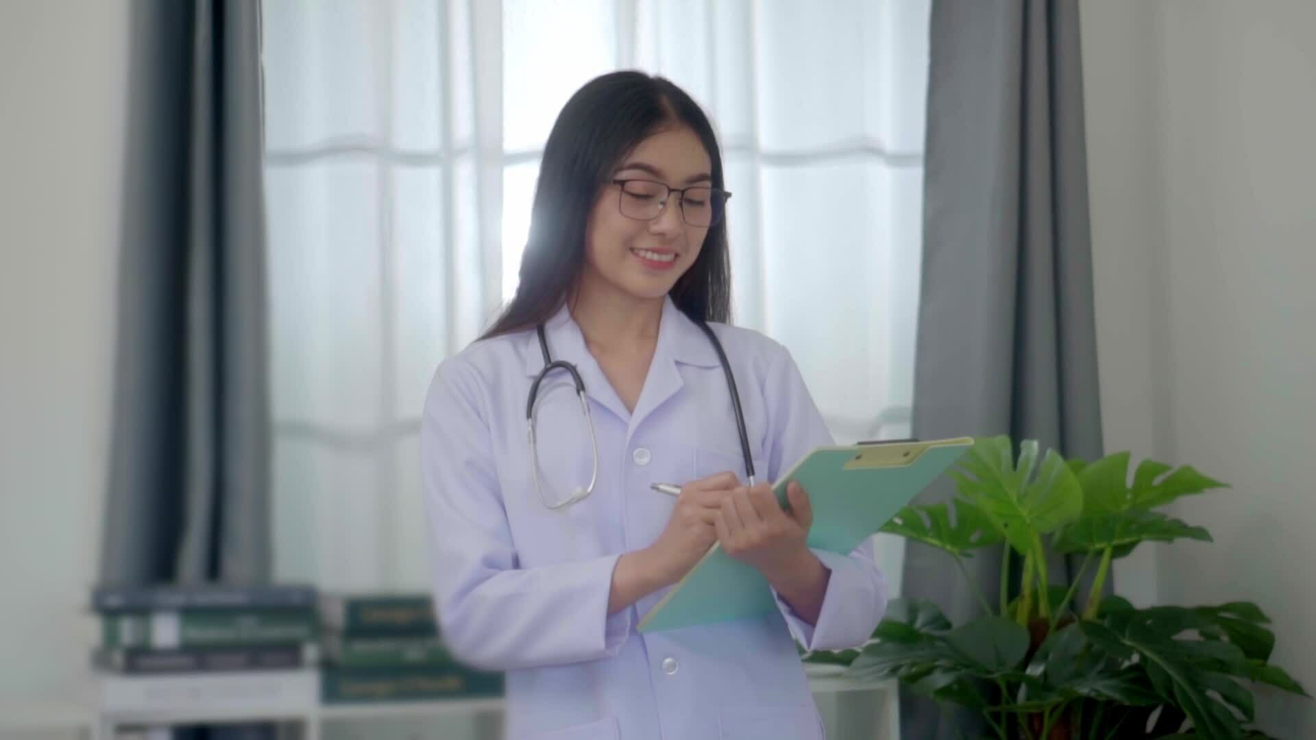 Professional Asian woman doctor examine report document of patient to plan the next treatment ...
