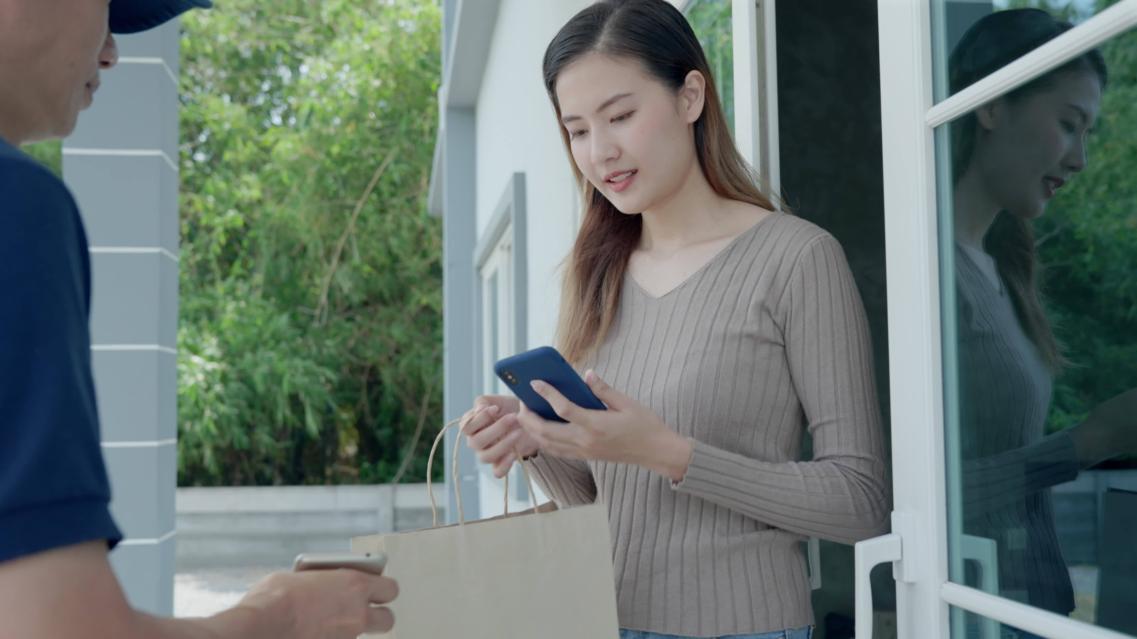 Happy smile Asian woman scan QR code for pay of food. Delivery man send deliver express. online ...