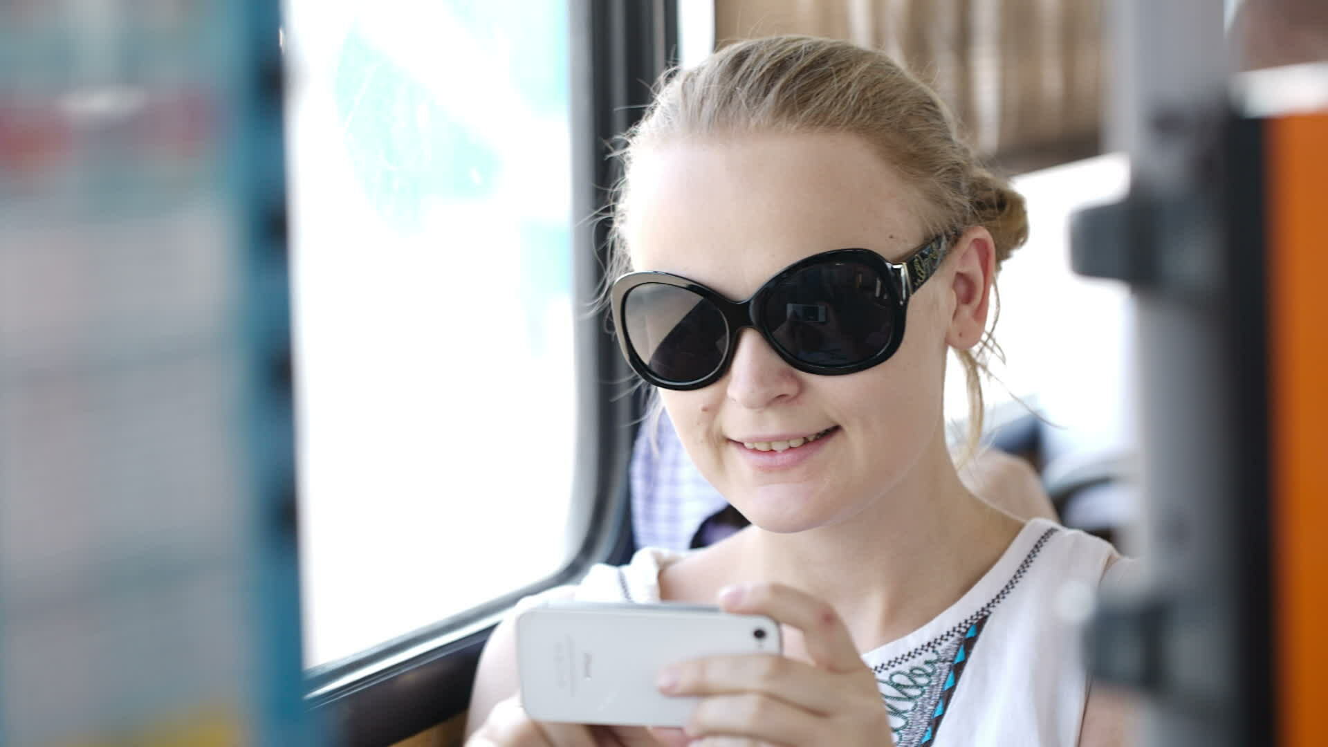 Woman taking pictures at her mobile on a bus 28296396 Stock Video at ...