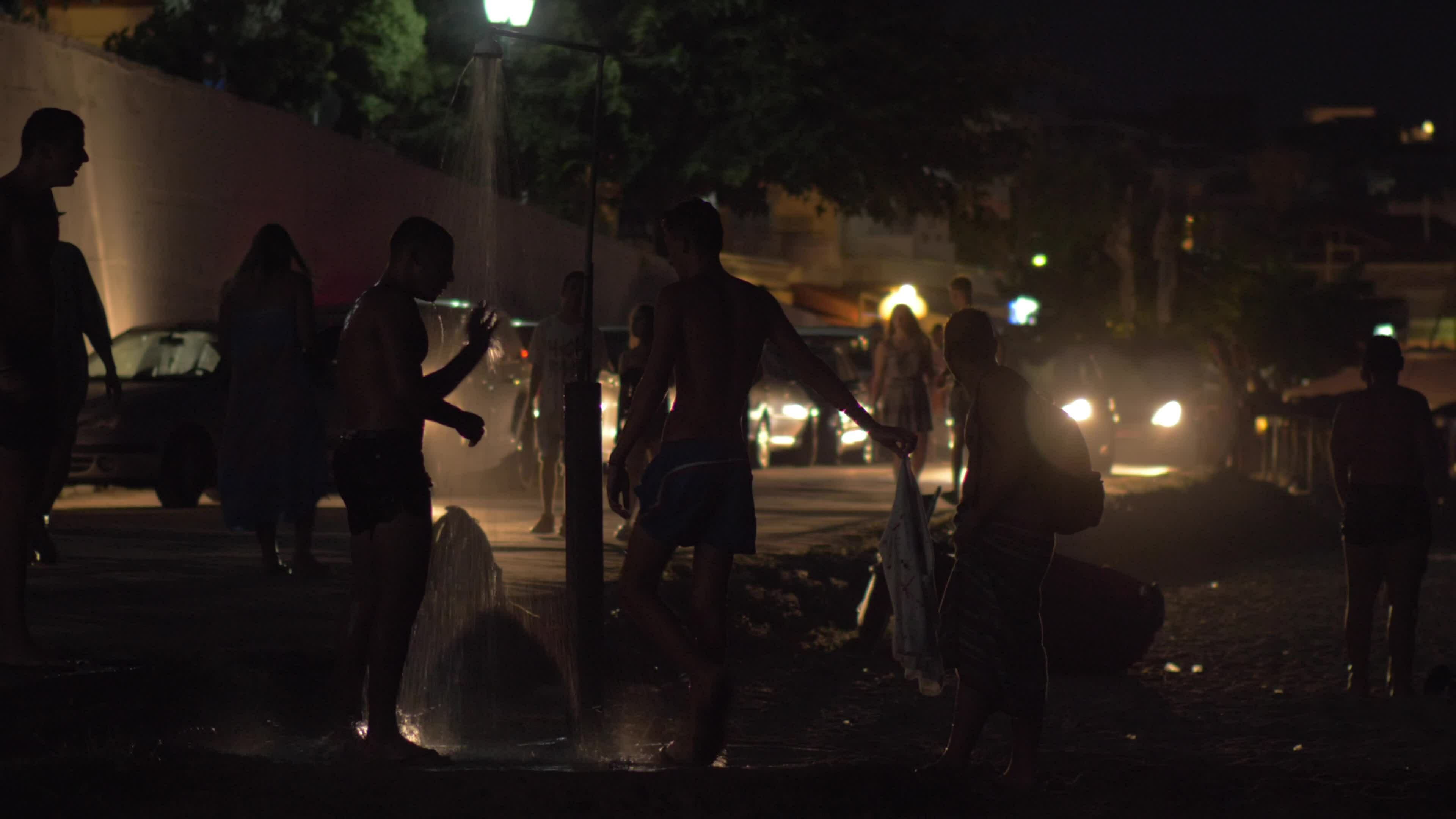 Several Men Taking Beach Shower At Night 28747612 Stock Video At Vecteezy