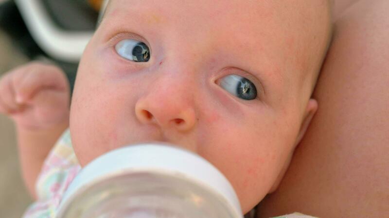 Thirsty baby drinking water from the bottle 28773817 Stock Video at Vecteezy