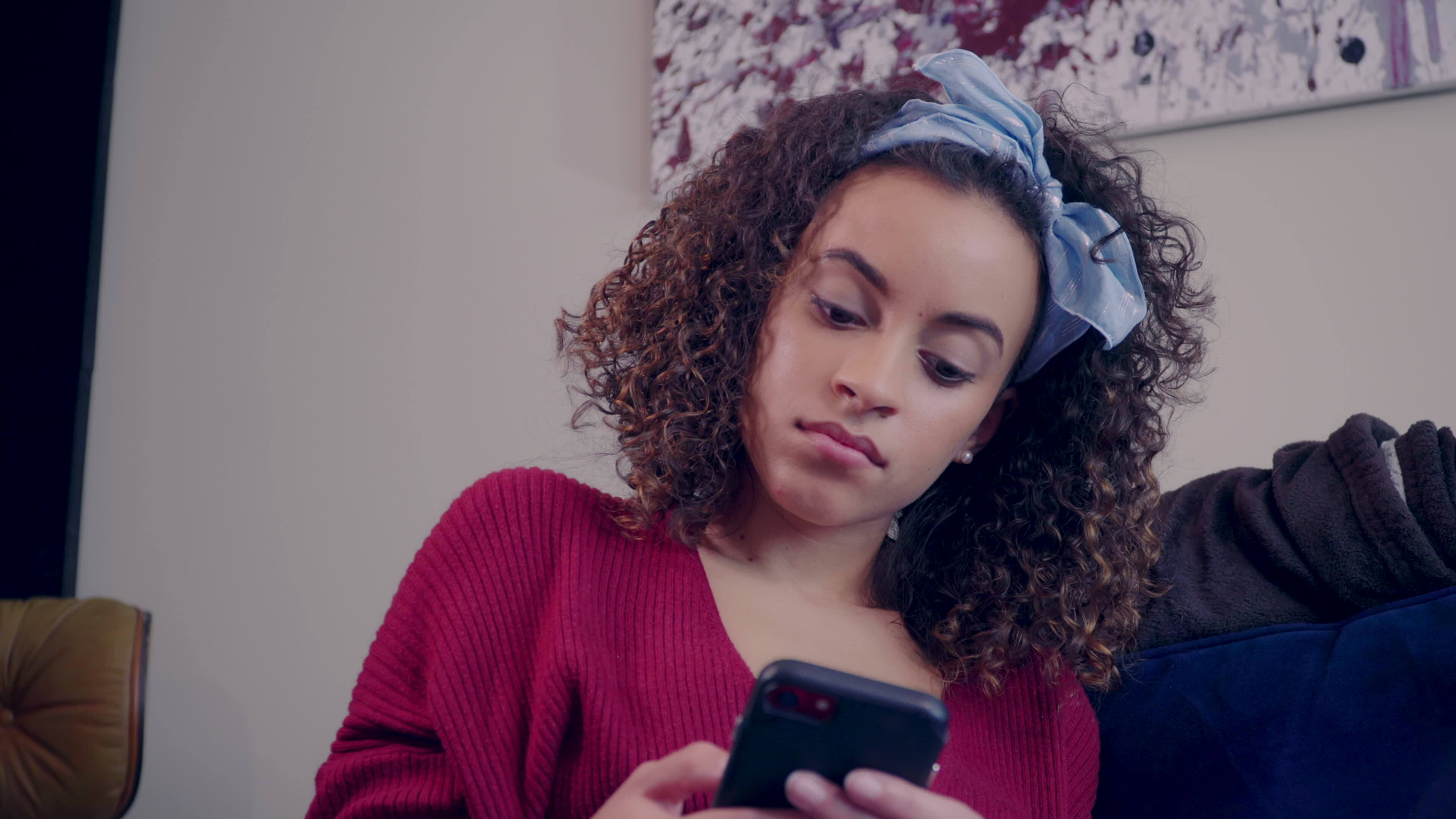 Hispanic Woman Alone In Home Looking At Instagram Or Tik Tok Social Media Apps 29471908 Stock