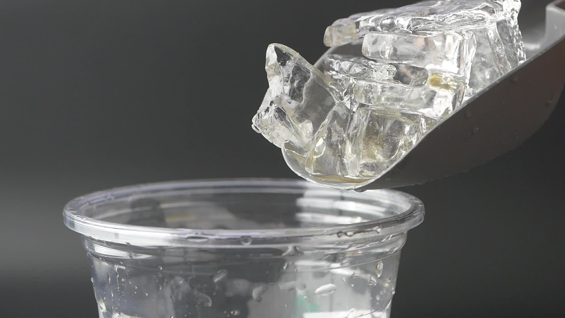 slow motion of pouring ice cube in a glass on black black background 30940000 Stock Video at ...