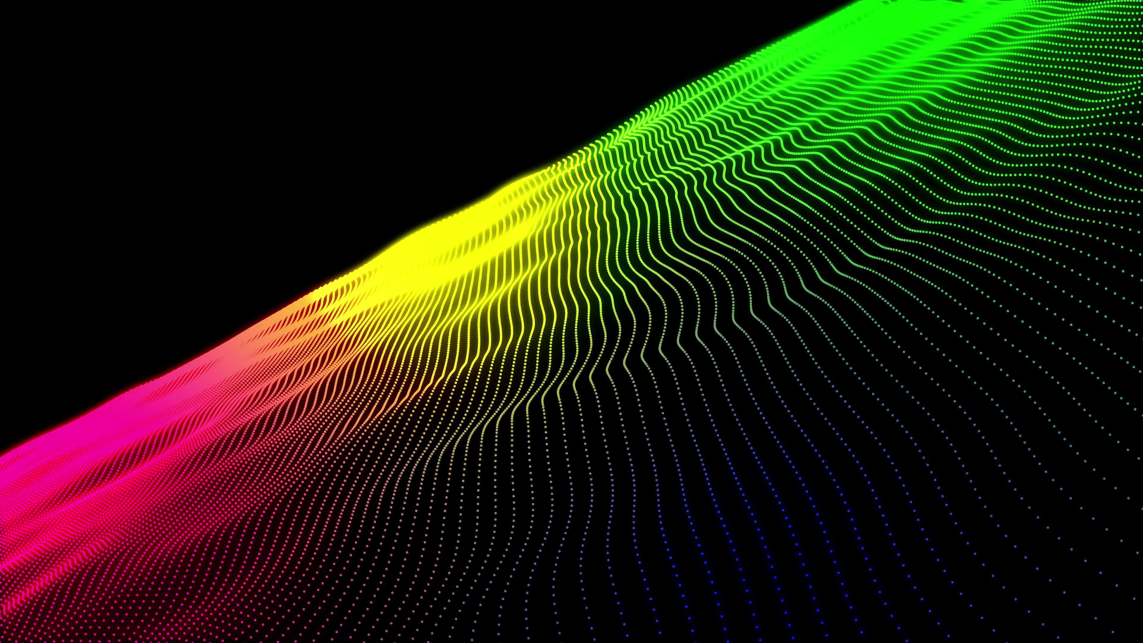 Digital multi-colored wave of particles on a black background ...