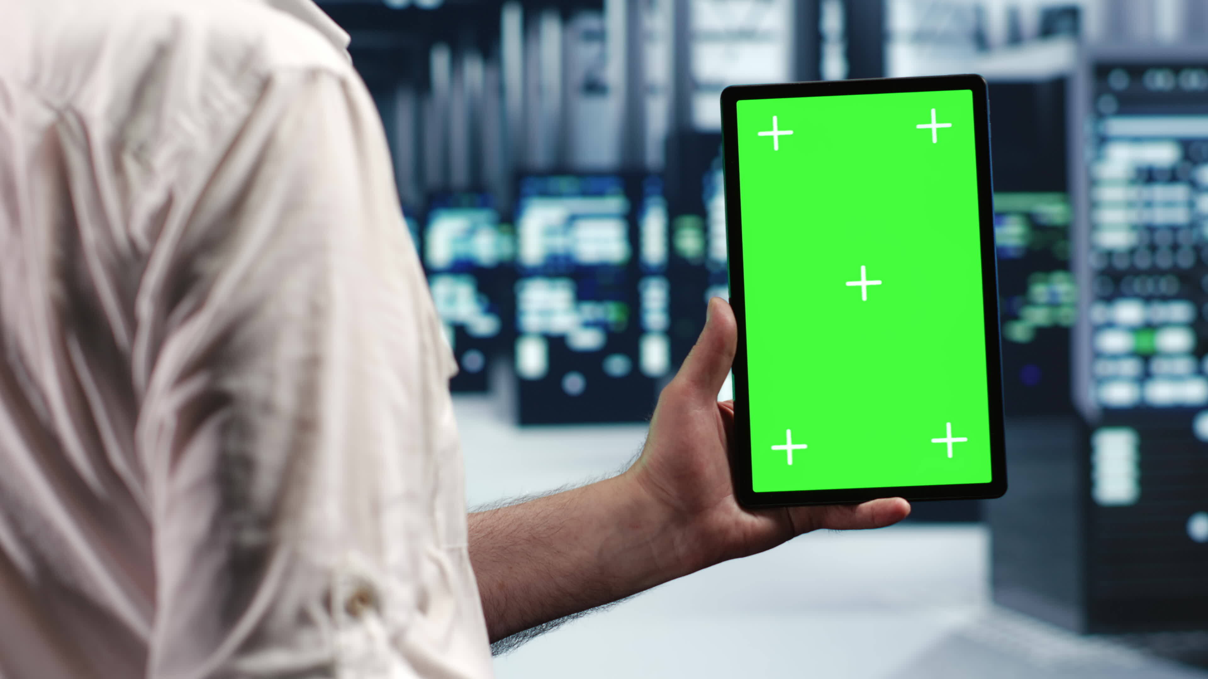 Elderly repairman in data center using mockup tablet to monitor energy ... Elderly repairman in data center using mockup tablet to monitor energy ...