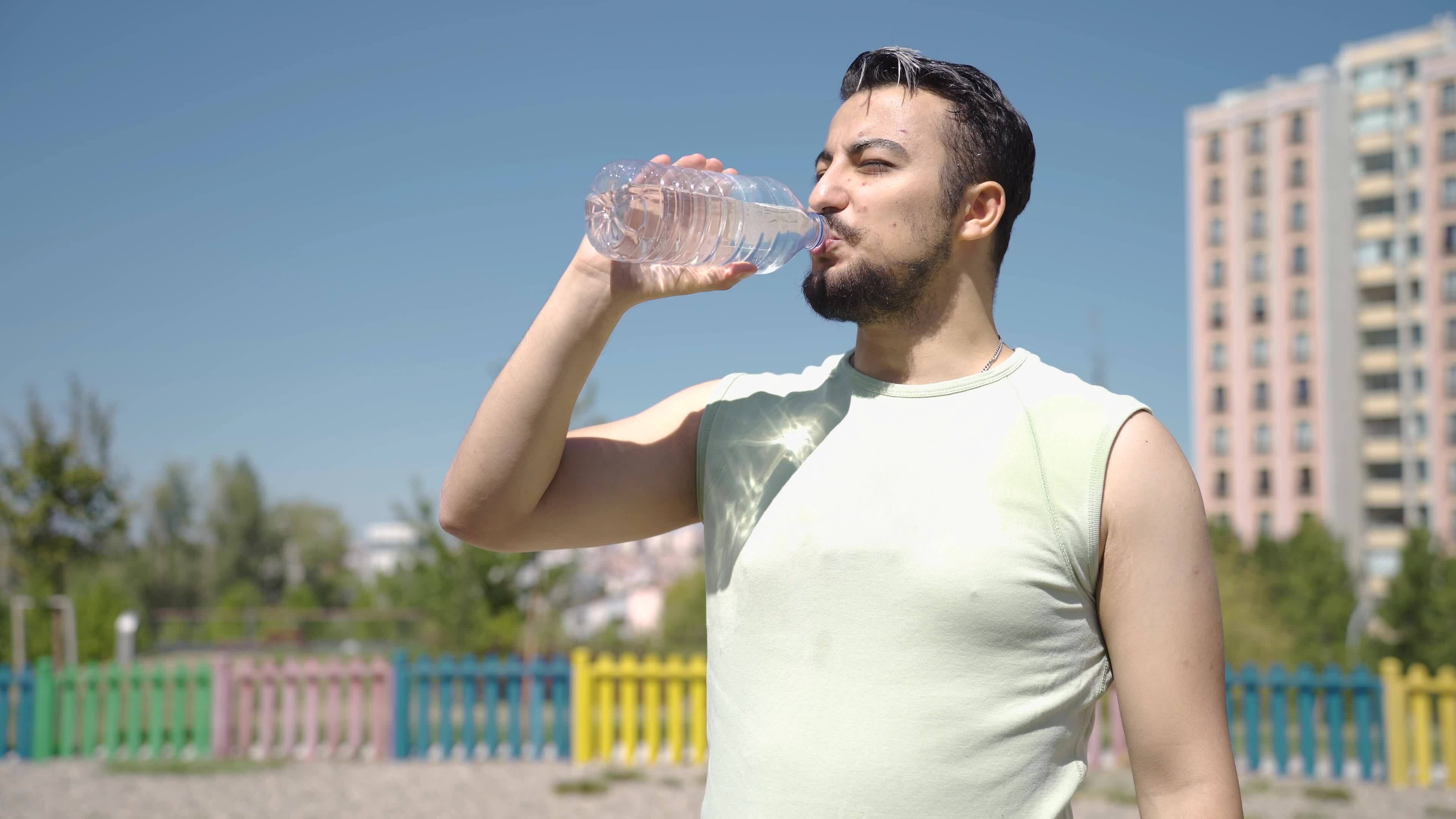 Boxer man drinking cold water, sweaty and tired. 32424954 Stock Video at Vecteezy