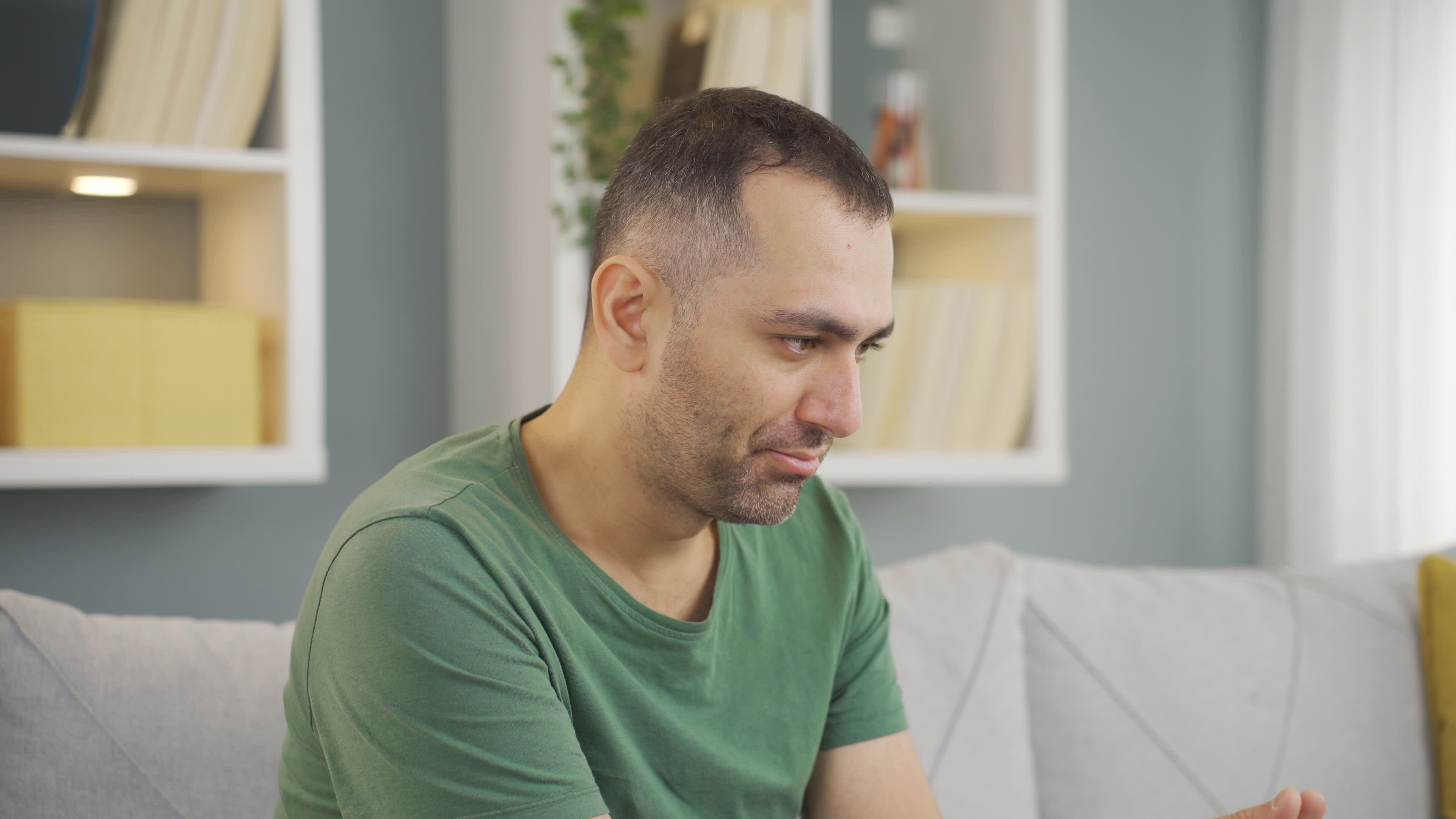 Unhappy and sad man looking at camera. 32506506 Stock Video at Vecteezy