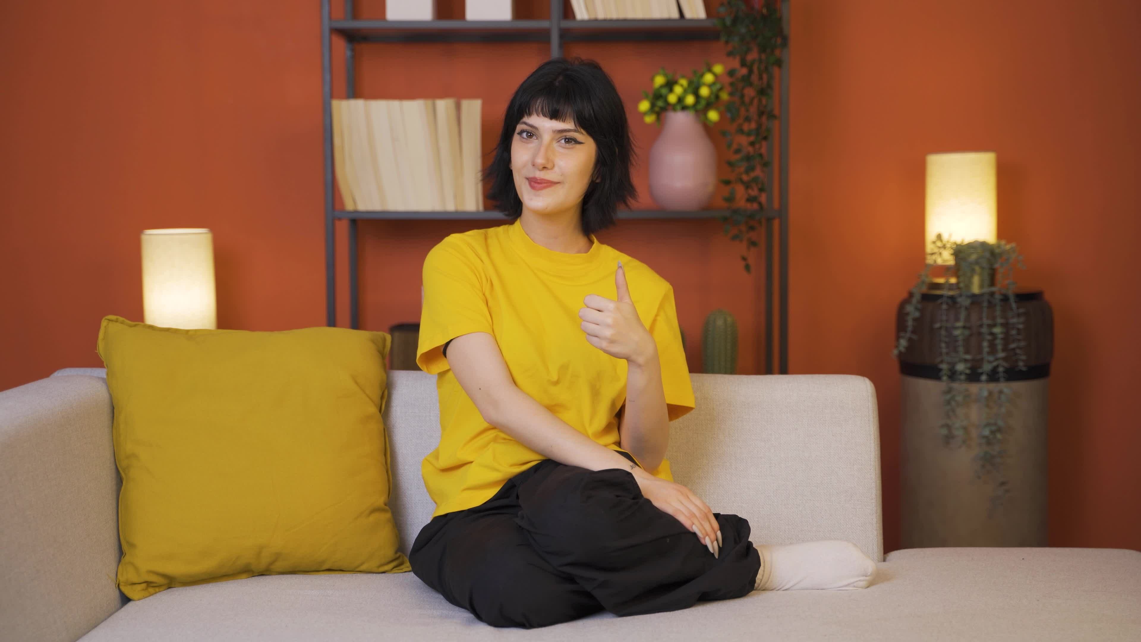 Woman making positive gesture at camera. 33029016 Stock Video at Vecteezy