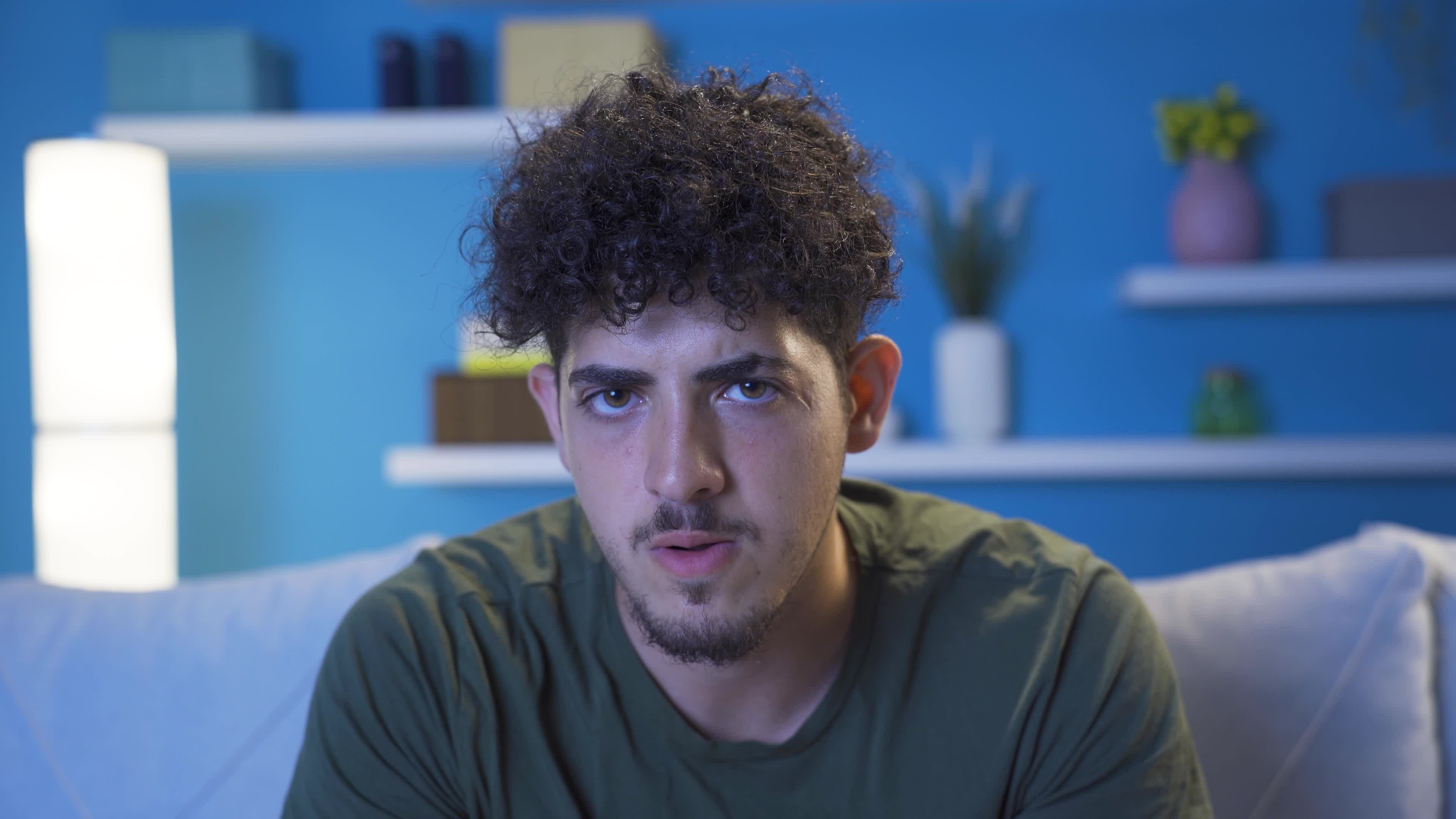 Close-up portrait of frustrated young man. 33033783 Stock Video at Vecteezy
