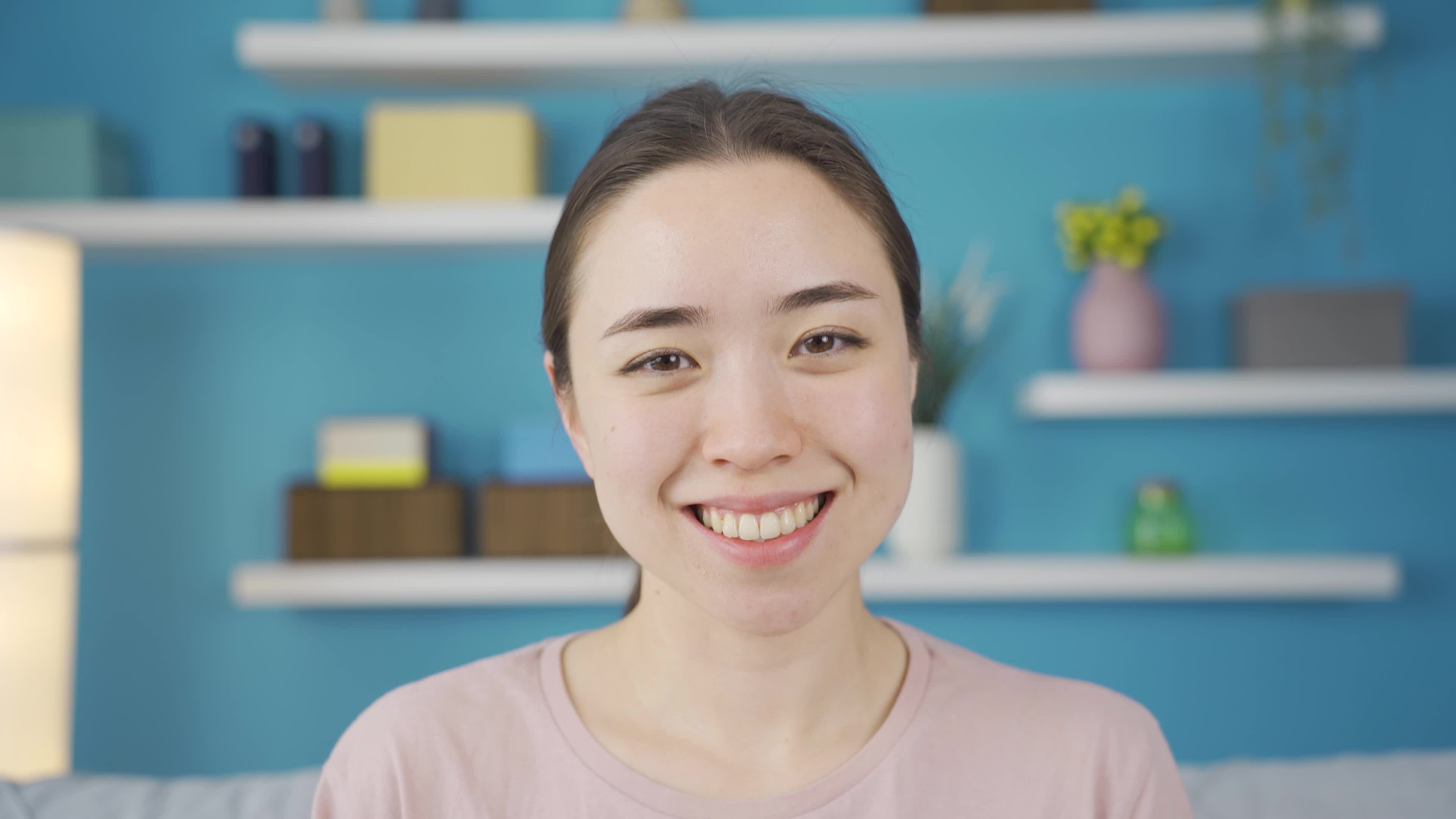 Close-up happy and cheerful Asian young woman. 33059292 Stock Video at Vecteezy