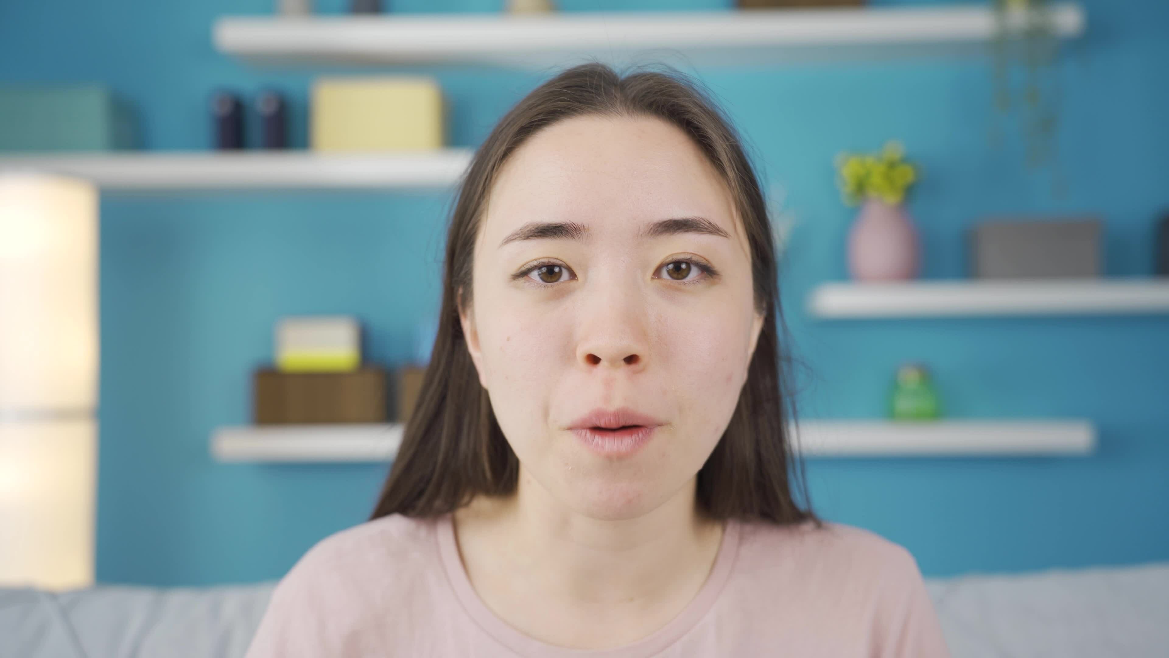 Close-up portrait of angry Asian young woman talking. 33066712 Stock Video at Vecteezy