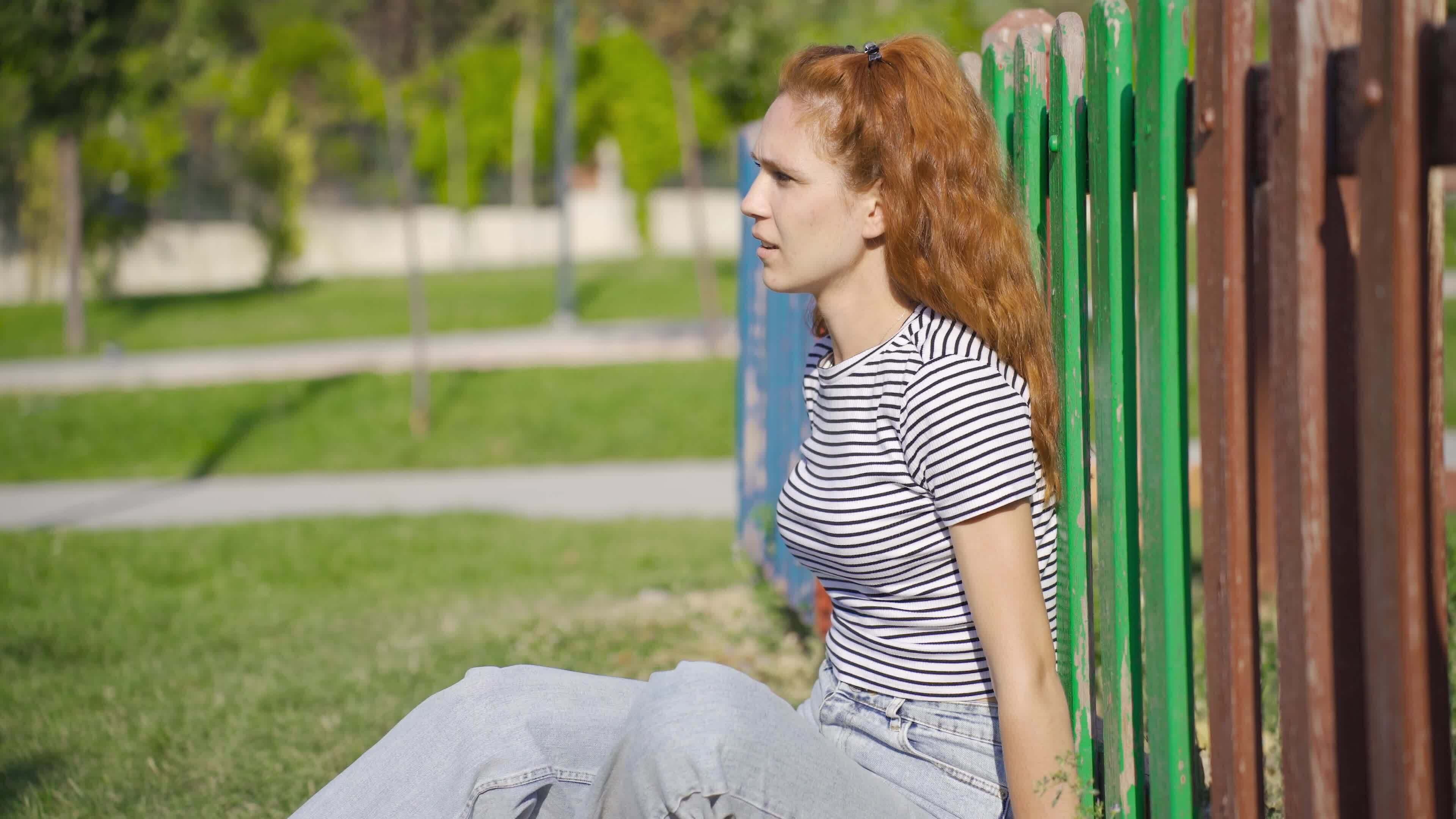 Paranoid young woman outdoors. 33066813 Stock Video at Vecteezy