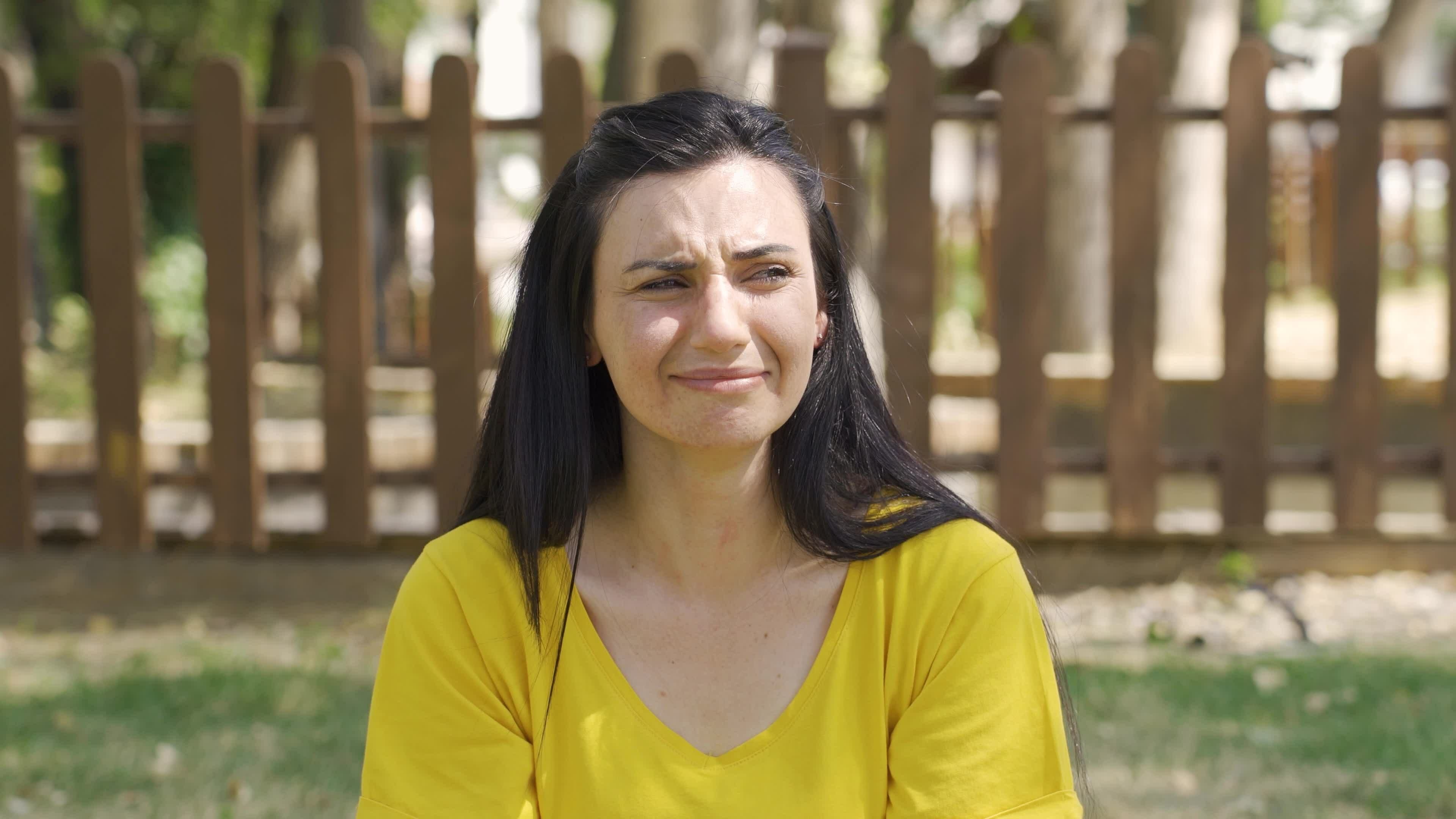 Sad and lonely woman crying in the park. 33066814 Stock Video at Vecteezy