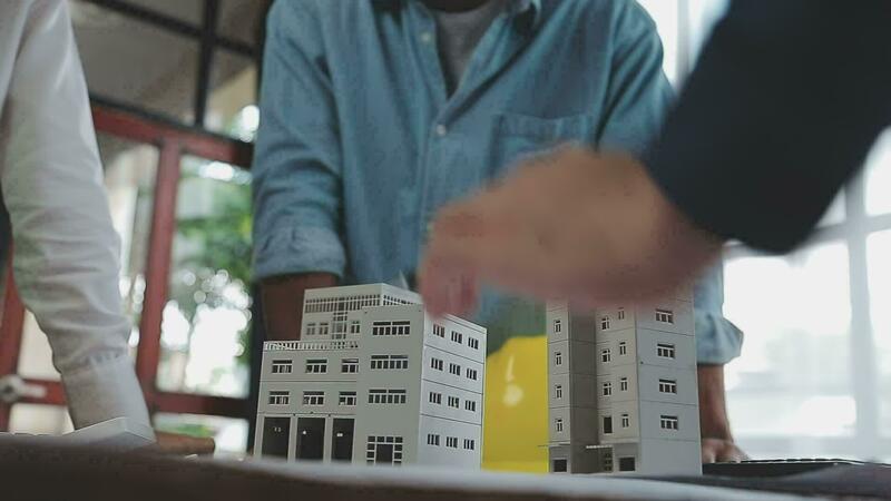 Architectural engineer team meeting Use of blueprints, construction ...