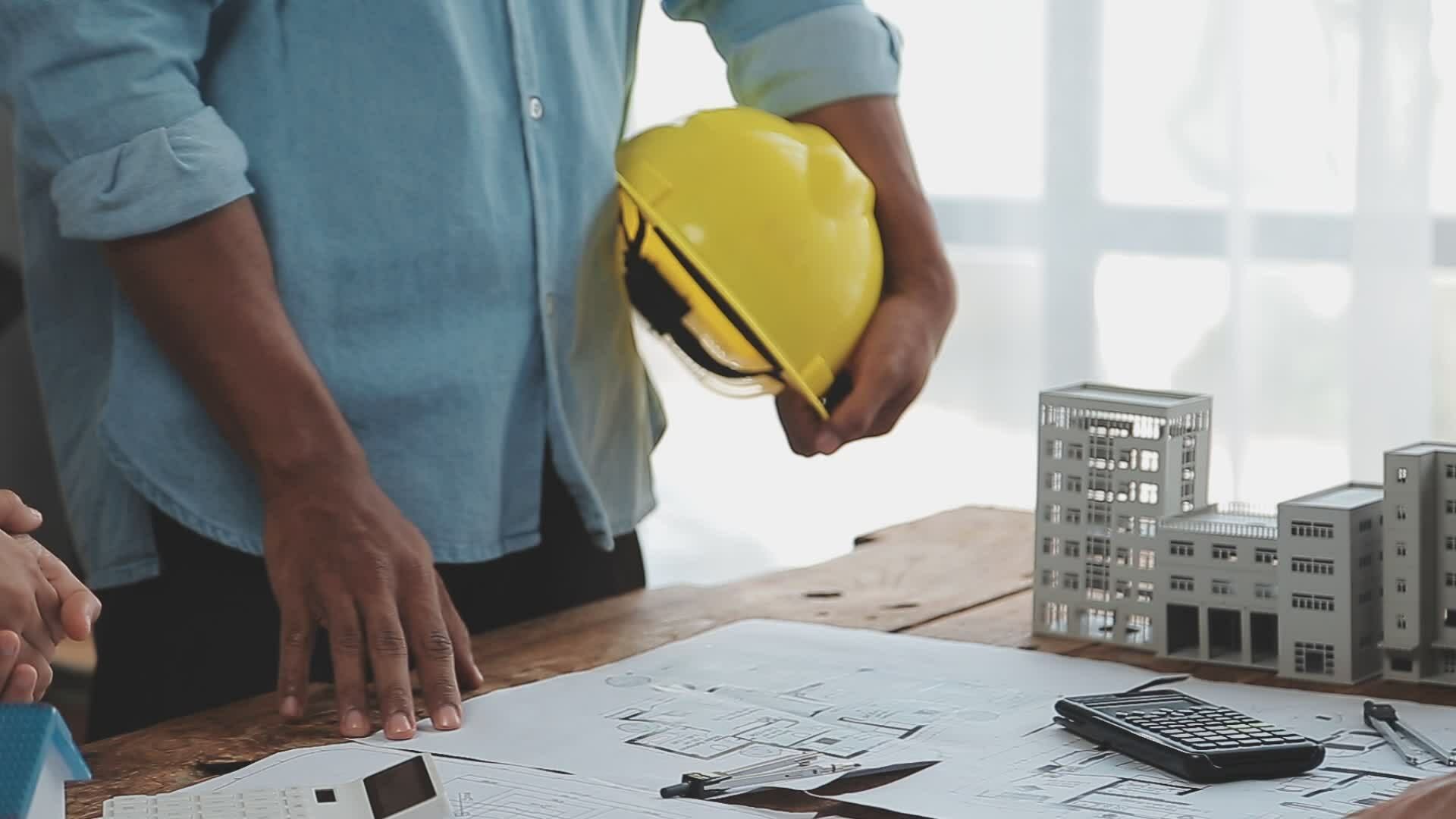 Architectural engineer team meeting Use of blueprints, construction ...