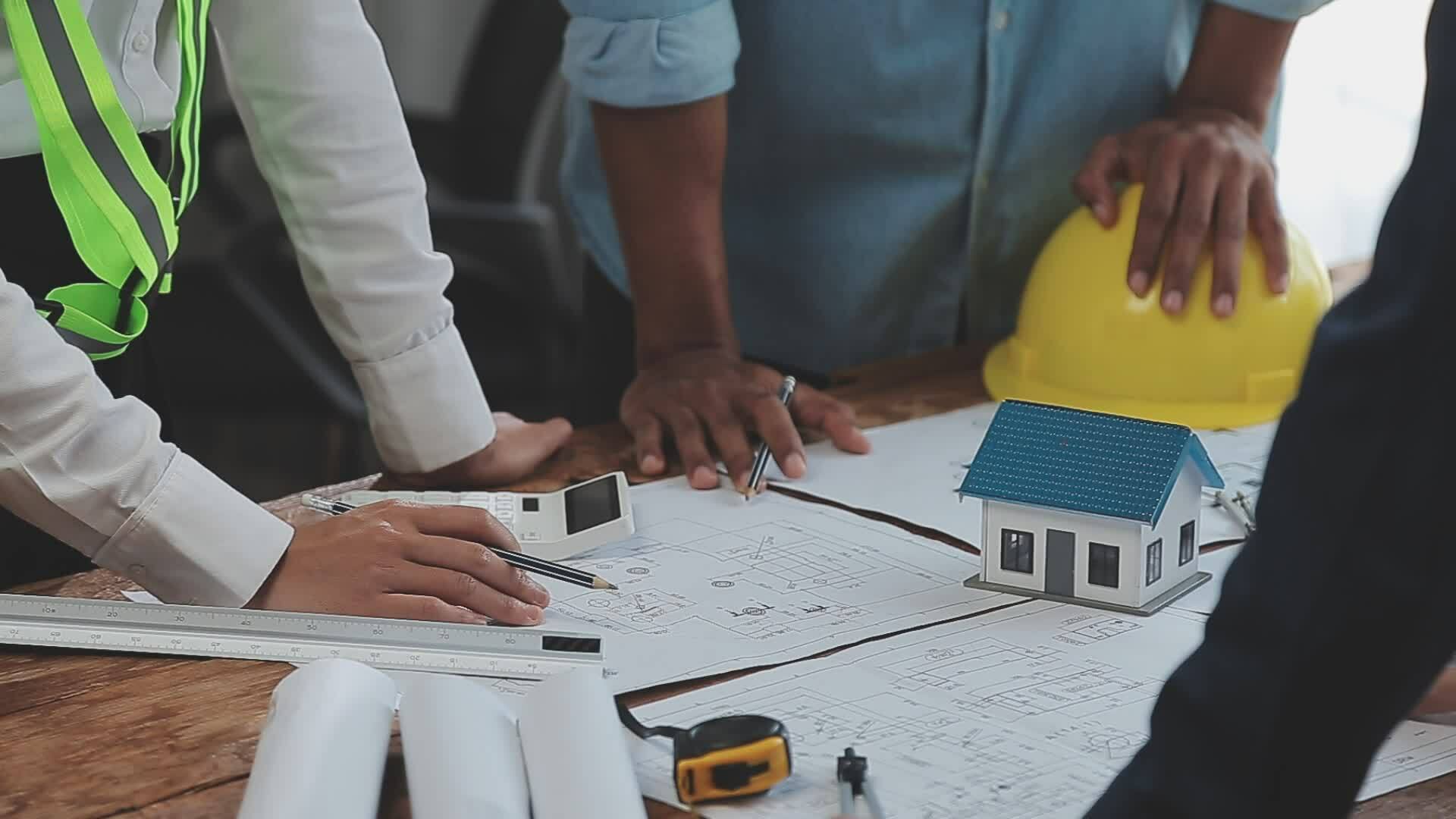 Architectural engineer team meeting Use of blueprints, construction ...