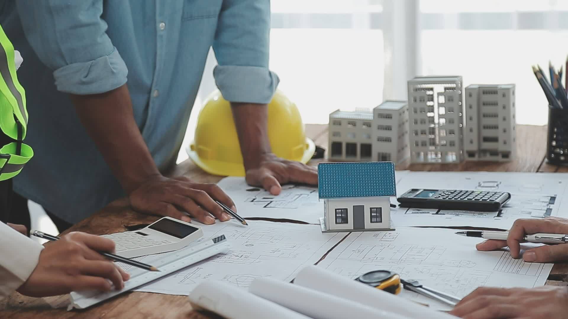 Architectural engineer team meeting Use of blueprints, construction ...