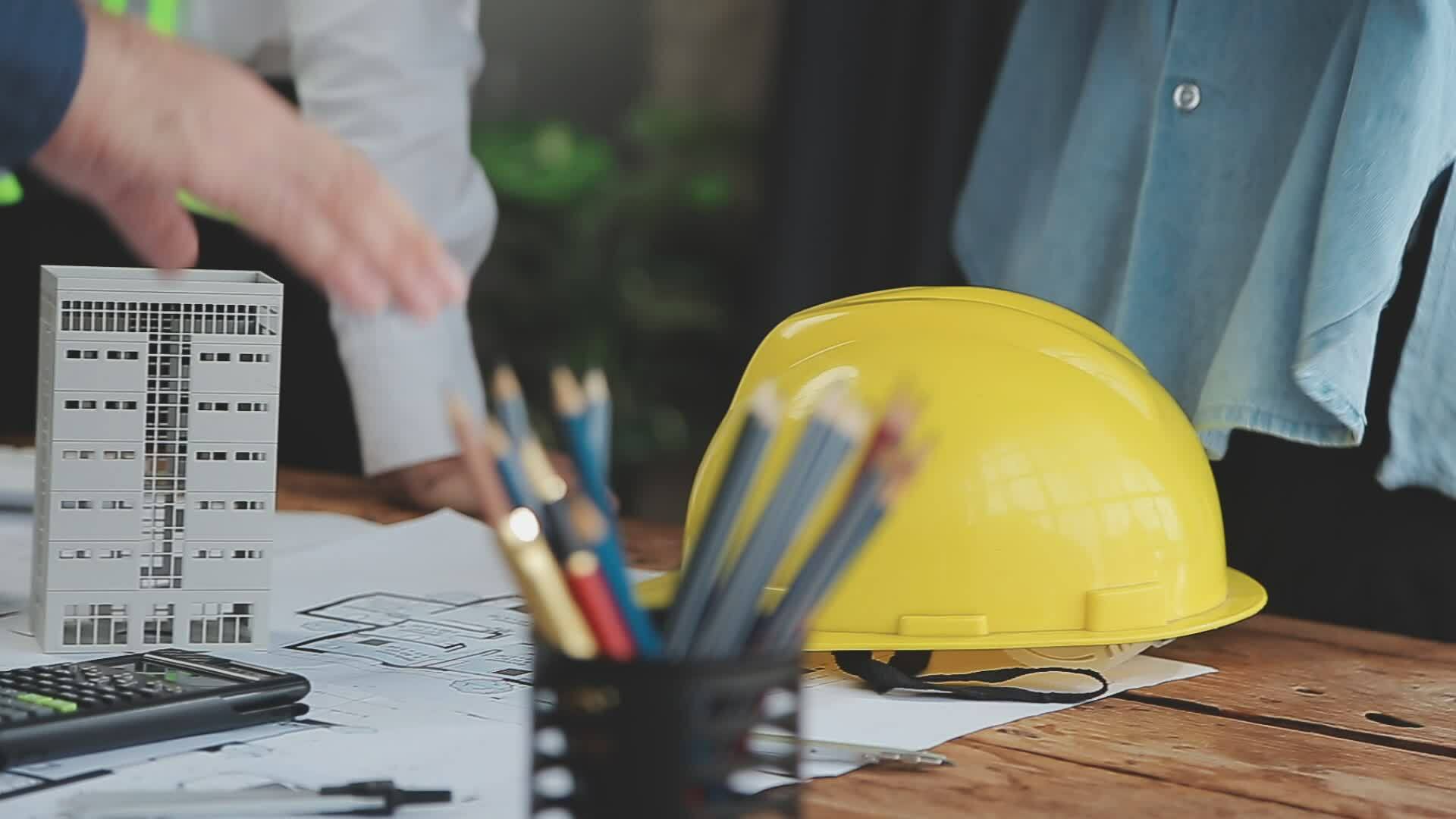 Architectural engineer team meeting Use of blueprints, construction ...