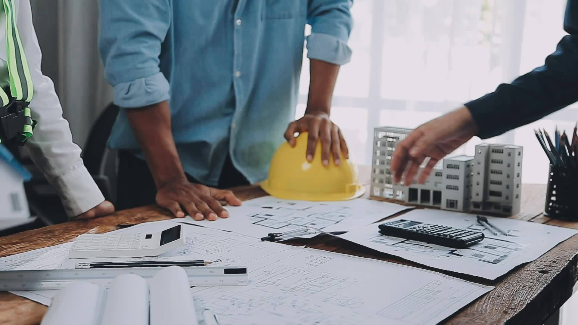 Architectural engineer team meeting Use of blueprints, construction ...