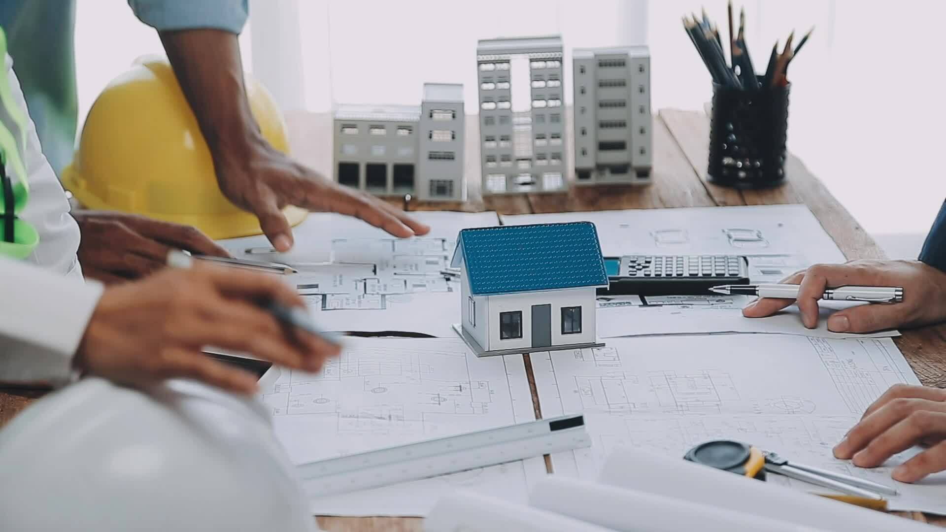 Architectural engineer team meeting Use of blueprints, construction ...