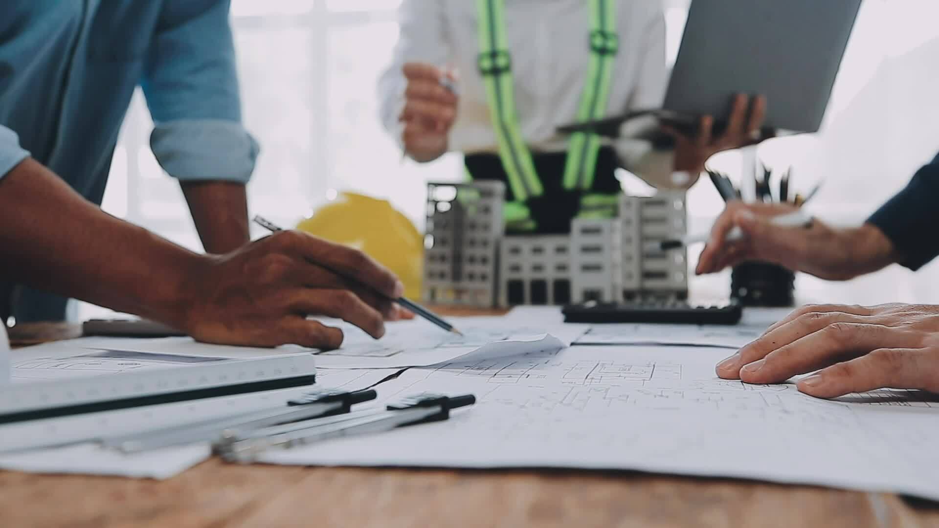 Architectural engineer team meeting Use of blueprints, construction ...