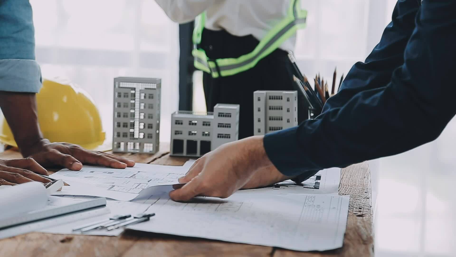 Architectural engineer team meeting Use of blueprints, construction ...