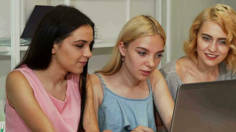 Happy beautiful women laughing while using laptop together 33196699 ... Happy beautiful women laughing while using laptop together 33196699 ...