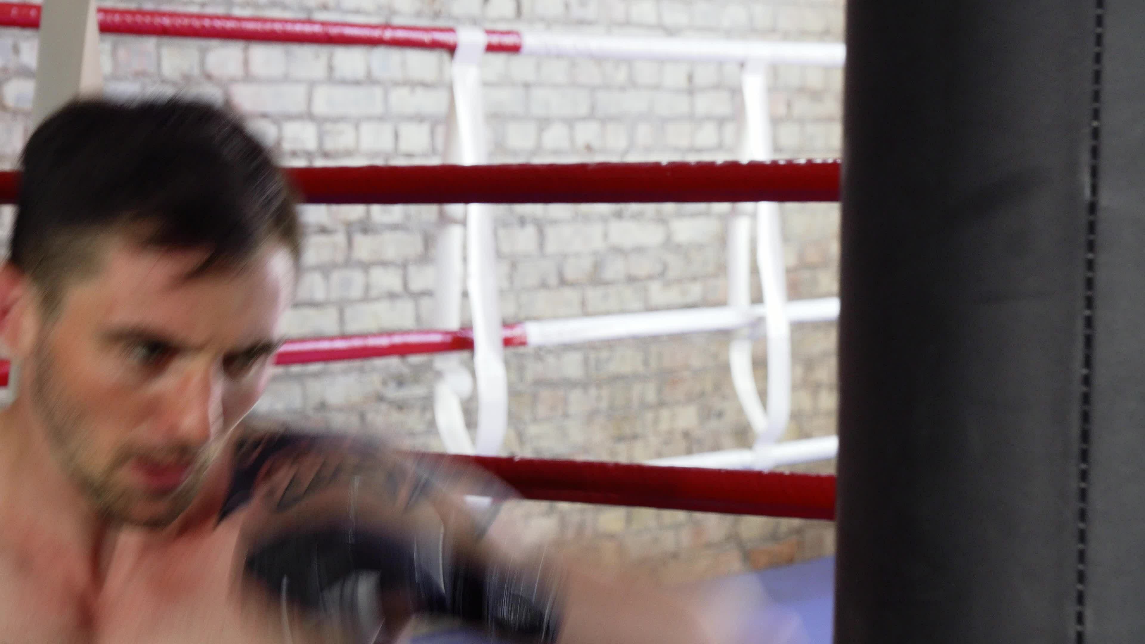 Handsome Male Boxer Practicing His Punches On Punching Bag 33196842 Stock Video At Vecteezy