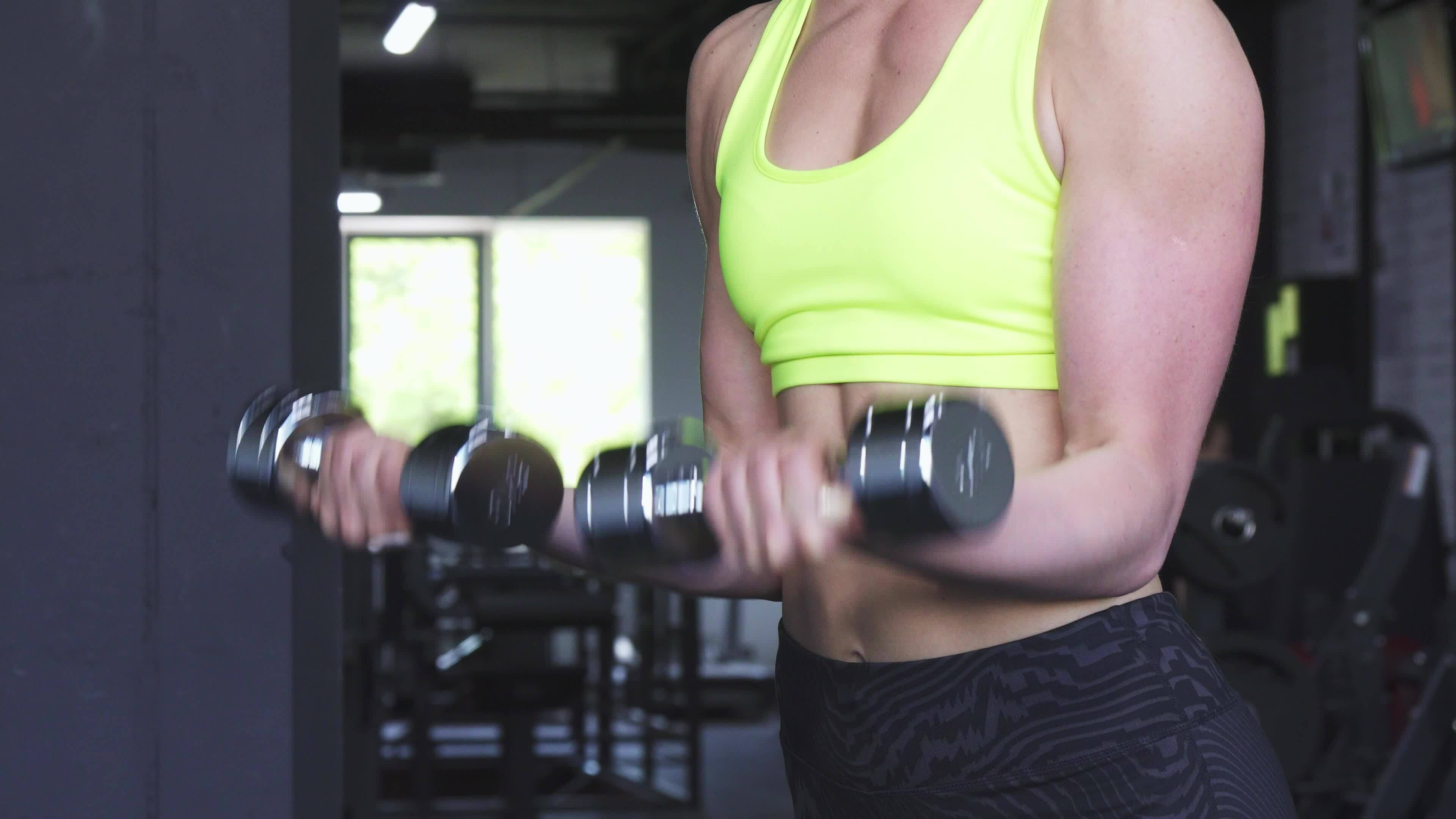 Cropped shot of a strong athletic woman lifting dumbbells 33234203 ... Cropped shot of a strong athletic woman lifting dumbbells 33234203 ...