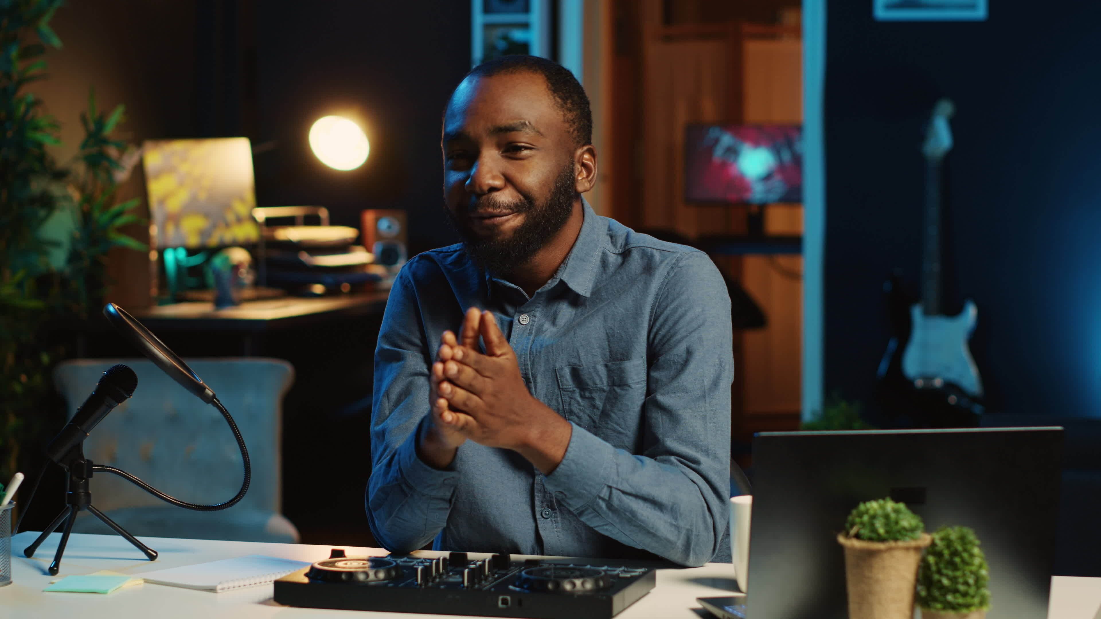 Tech content creator filming technology review of newly released DJ controller, unpacking it and ...