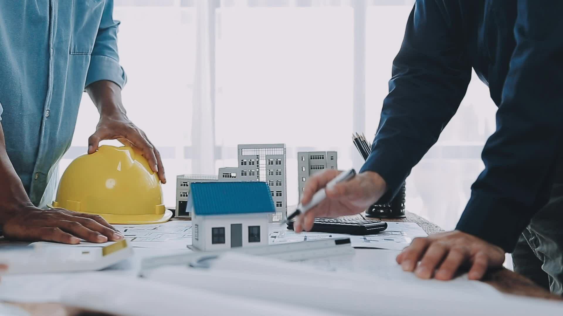 Architectural engineer team meeting Use of blueprints, construction ...