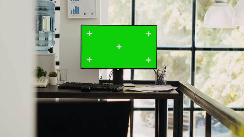 Modern Coworking Space With Monitor Showing Isolated Greenscreen Blank