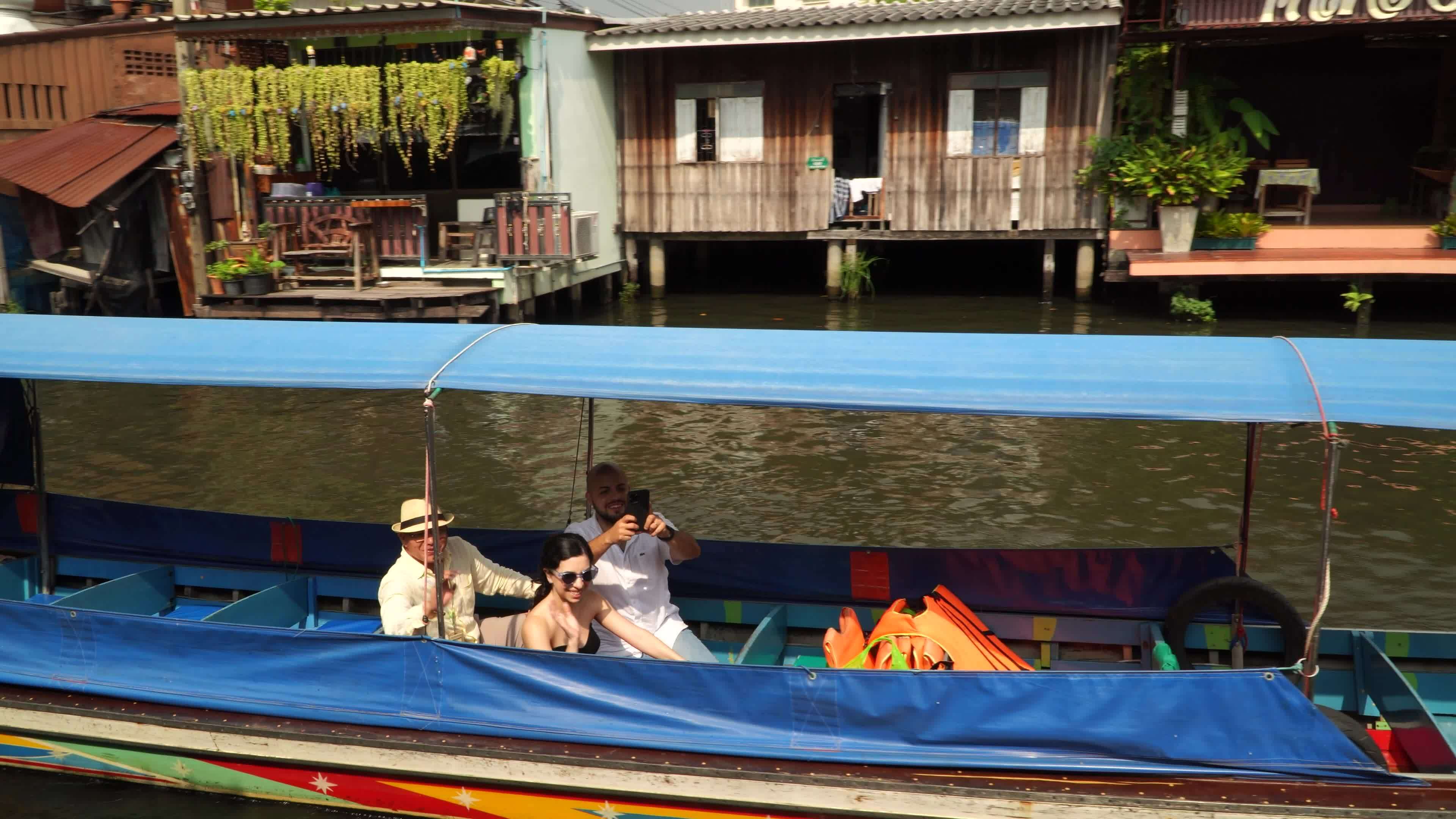 Tha Phra,Thailand-October 16, 2022 tourist Take a taxi ride to see the communities along the ...