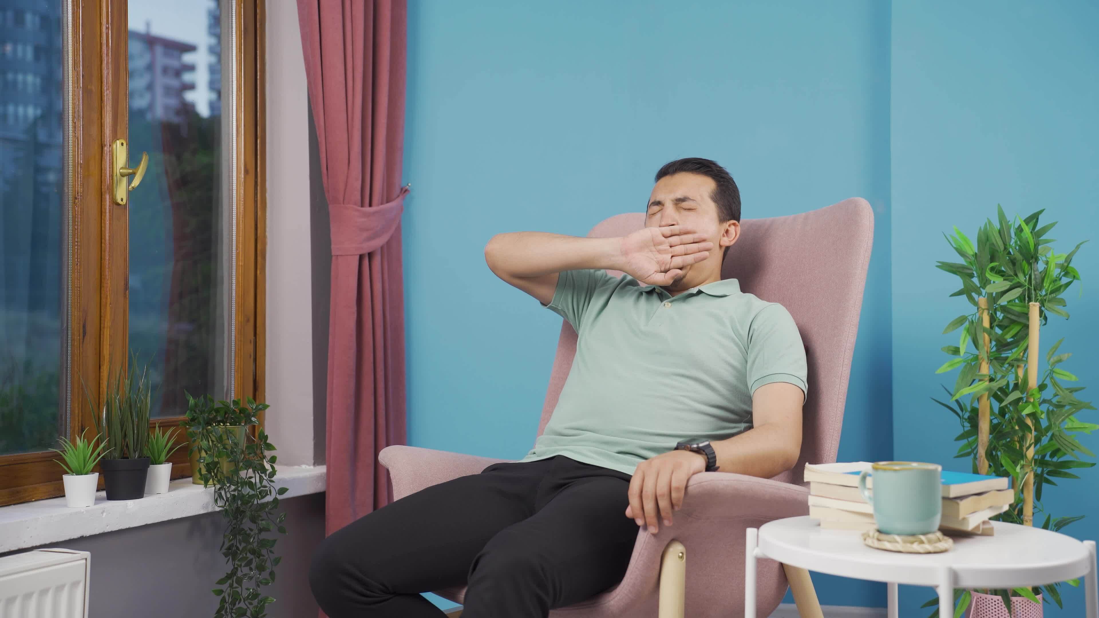 Man lying on the sofa is resting. 33501208 Stock Video at Vecteezy