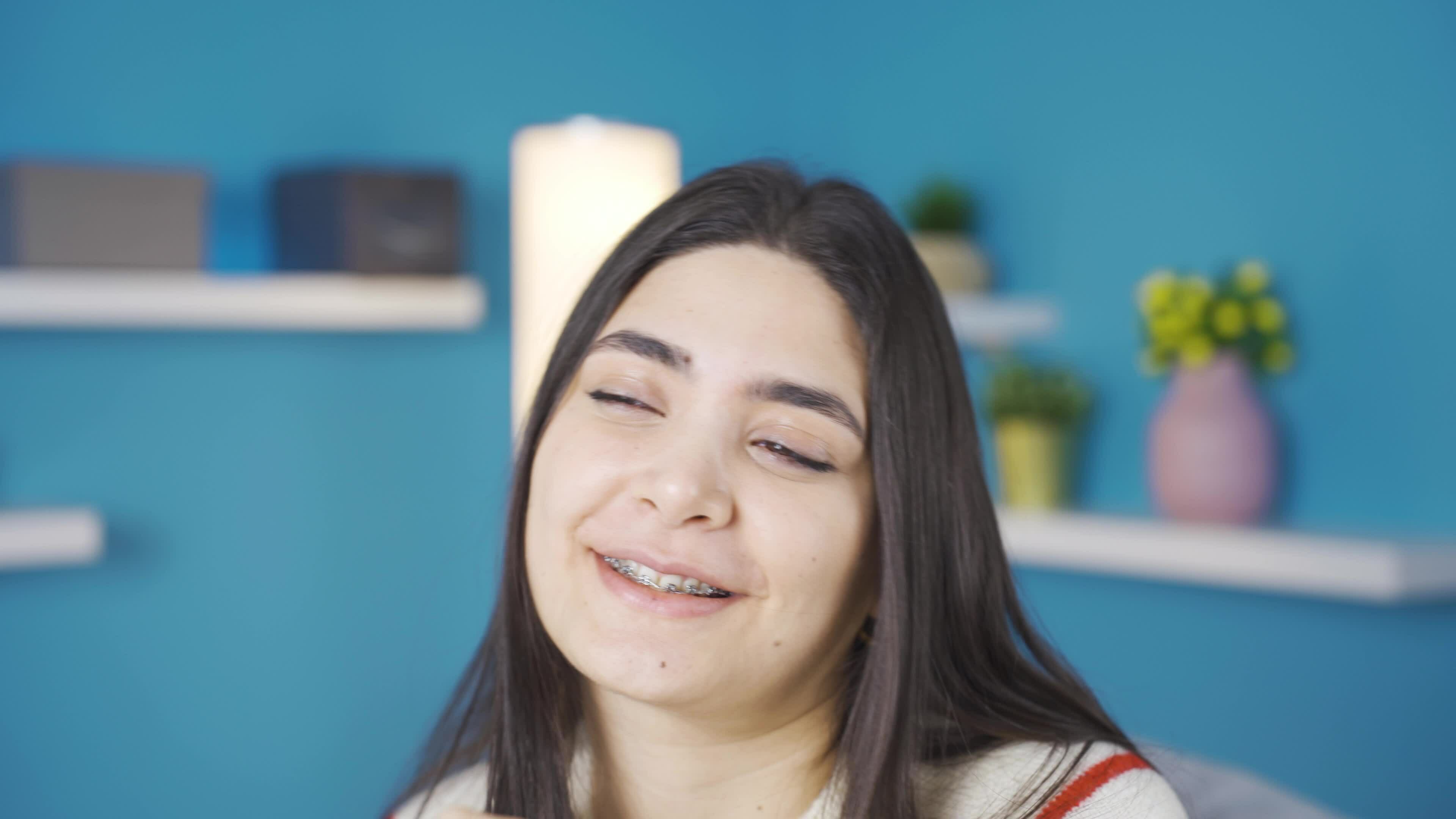 Smiling happy young woman with braces. 33545839 Stock Video at Vecteezy Smiling happy young woman with braces. 33545839 Stock Video at Vecteezy