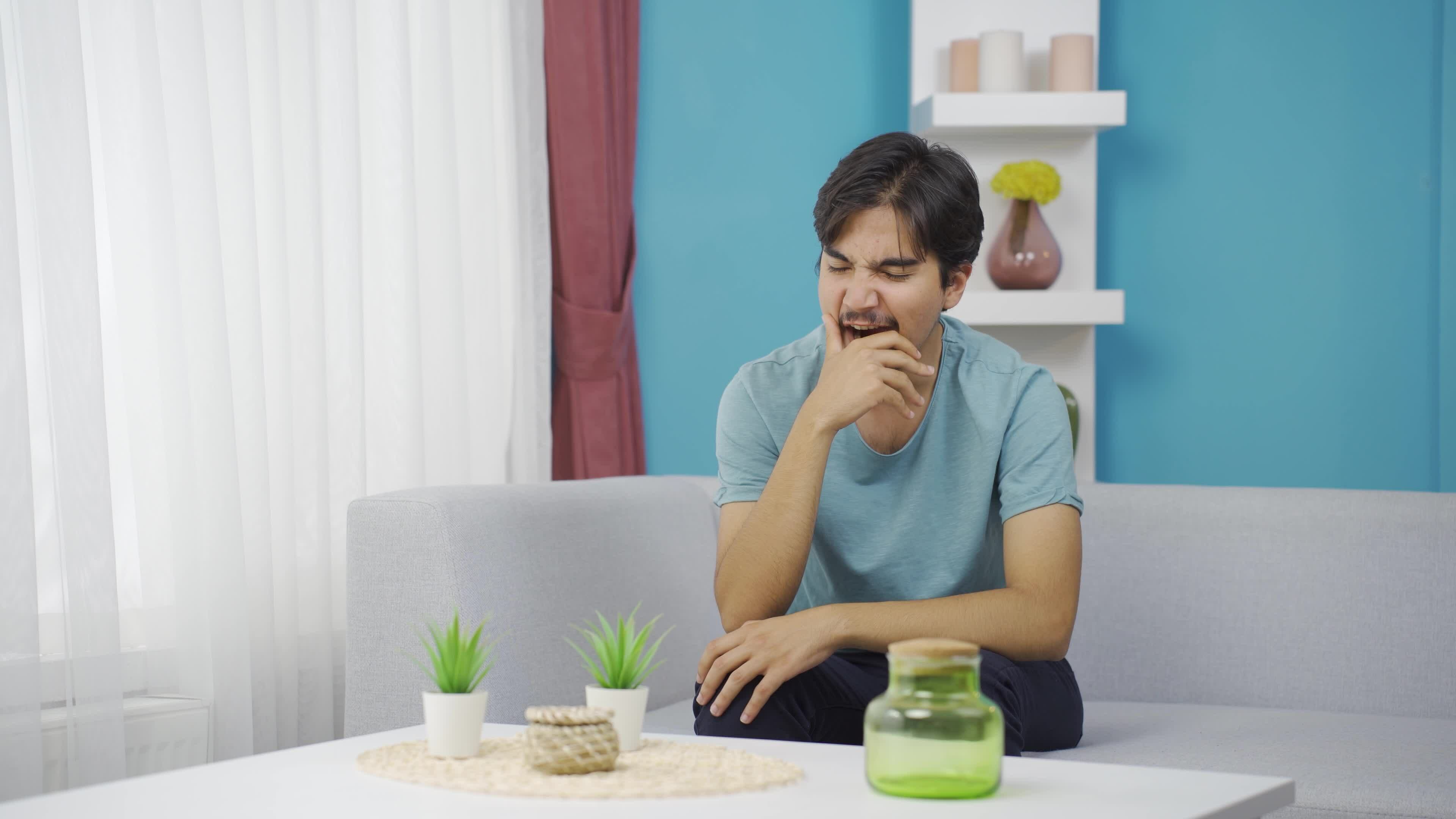 Happy man lying on the sofa. He is resting. 33546501 Stock Video at ...