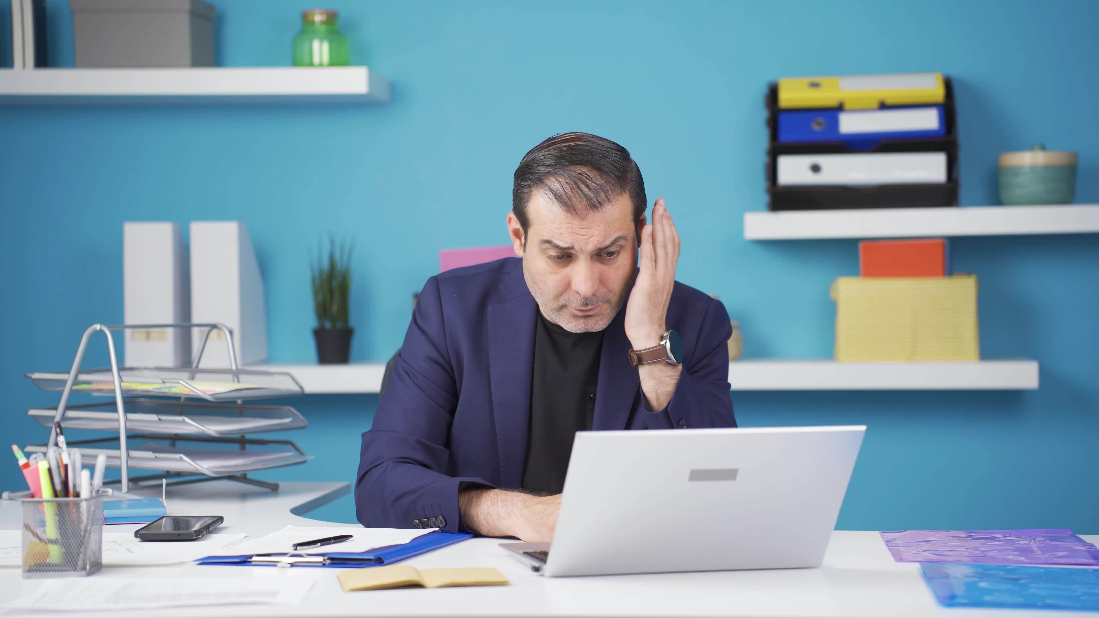 Frustrated businessman on laptop. 33550155 Stock Video at Vecteezy