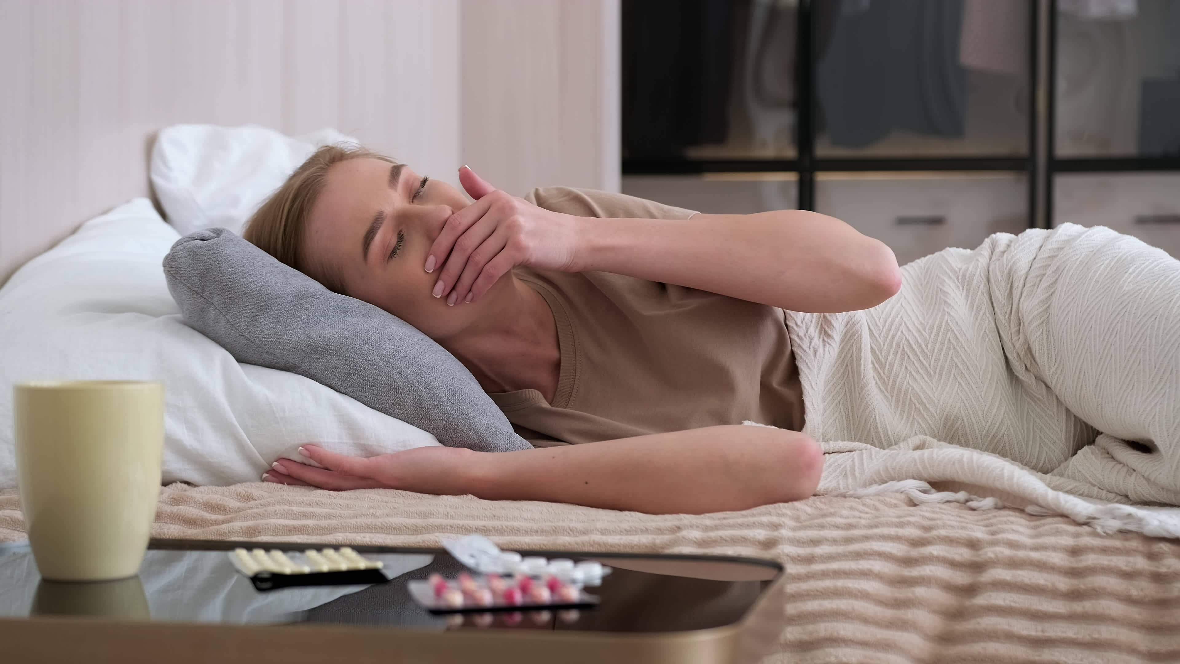 Sick Woman Drinks Cough Pill While Lying On Bed At Home 33552043 Stock