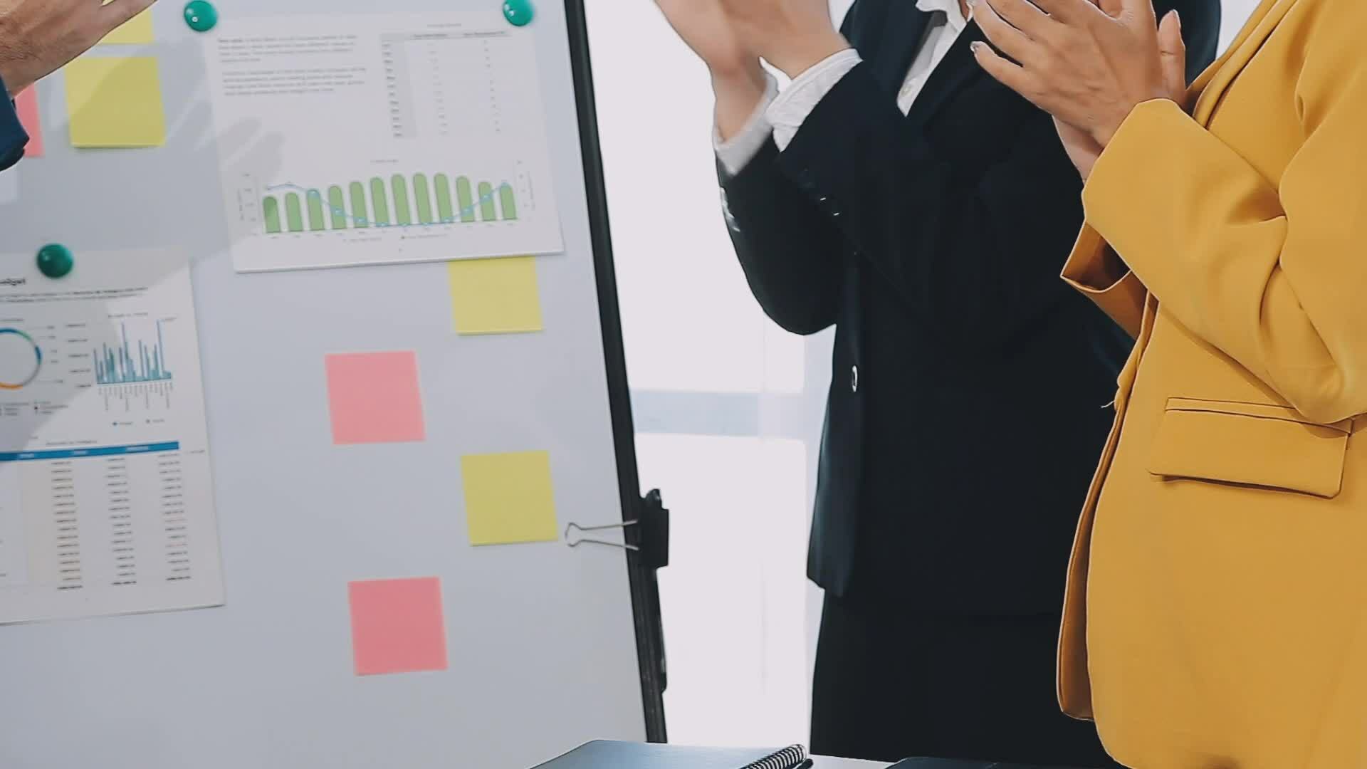 Two creative business people meeting and planning use post it notes ...