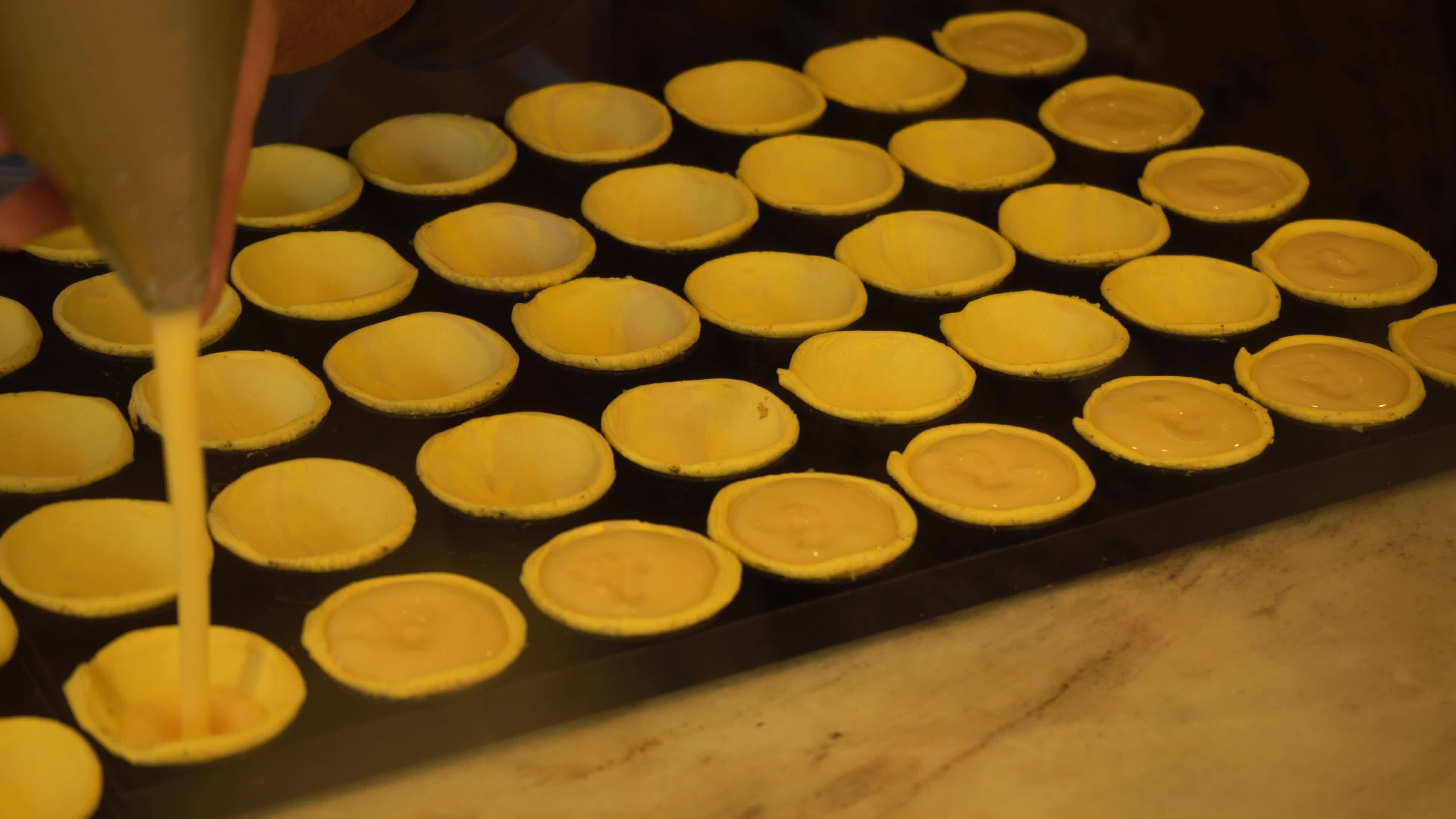 Pastry Chef Pouring Egg Custard Cream In Pastel De Nata Tarts Portuguese Traditional Egg
