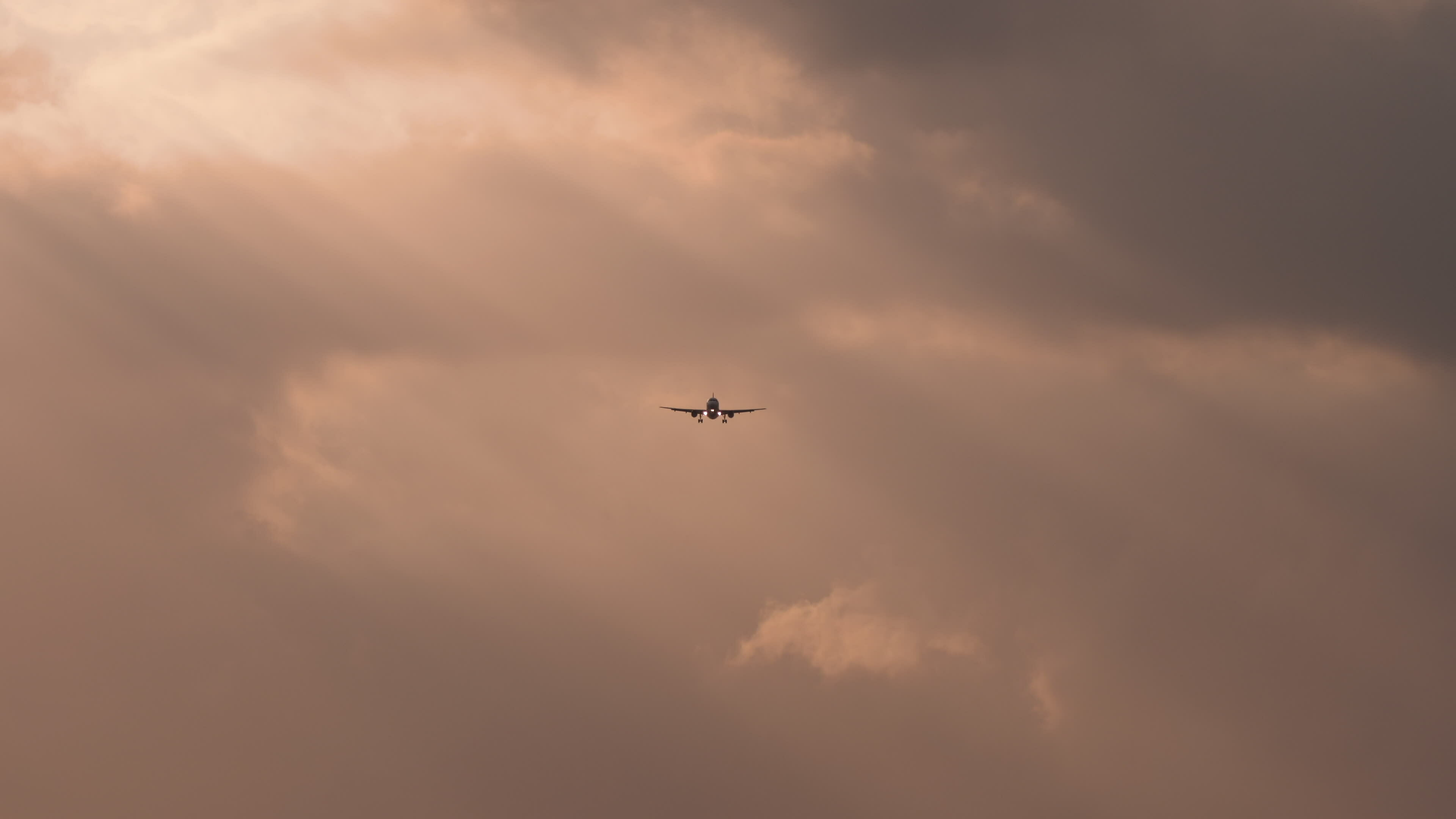 Dark Silhouette Of An Airplane Landing In The Sun Cloudy Sunset Jet