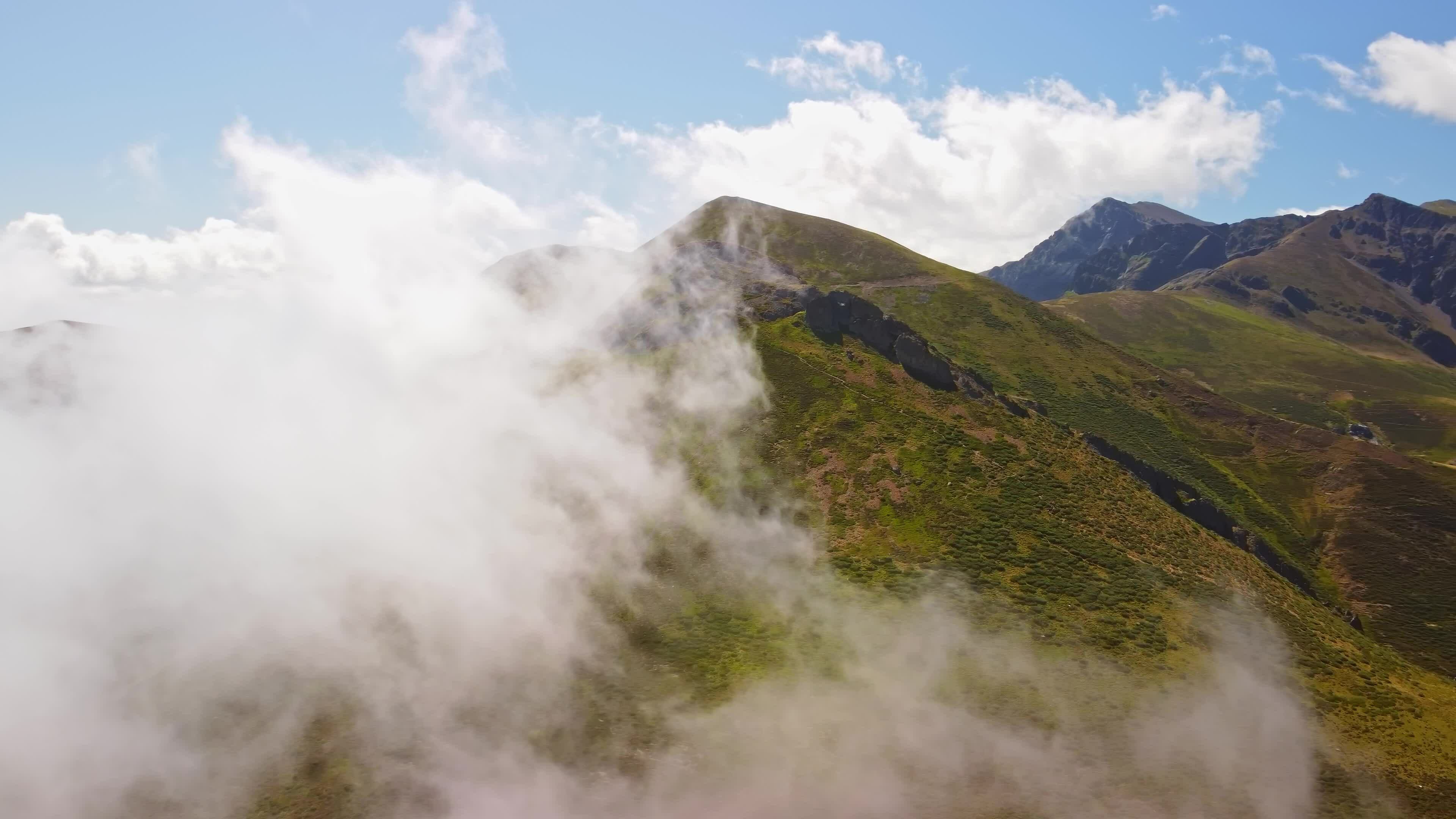 A majestic mountain range engulfed in clouds 34328253 Stock Video at ...