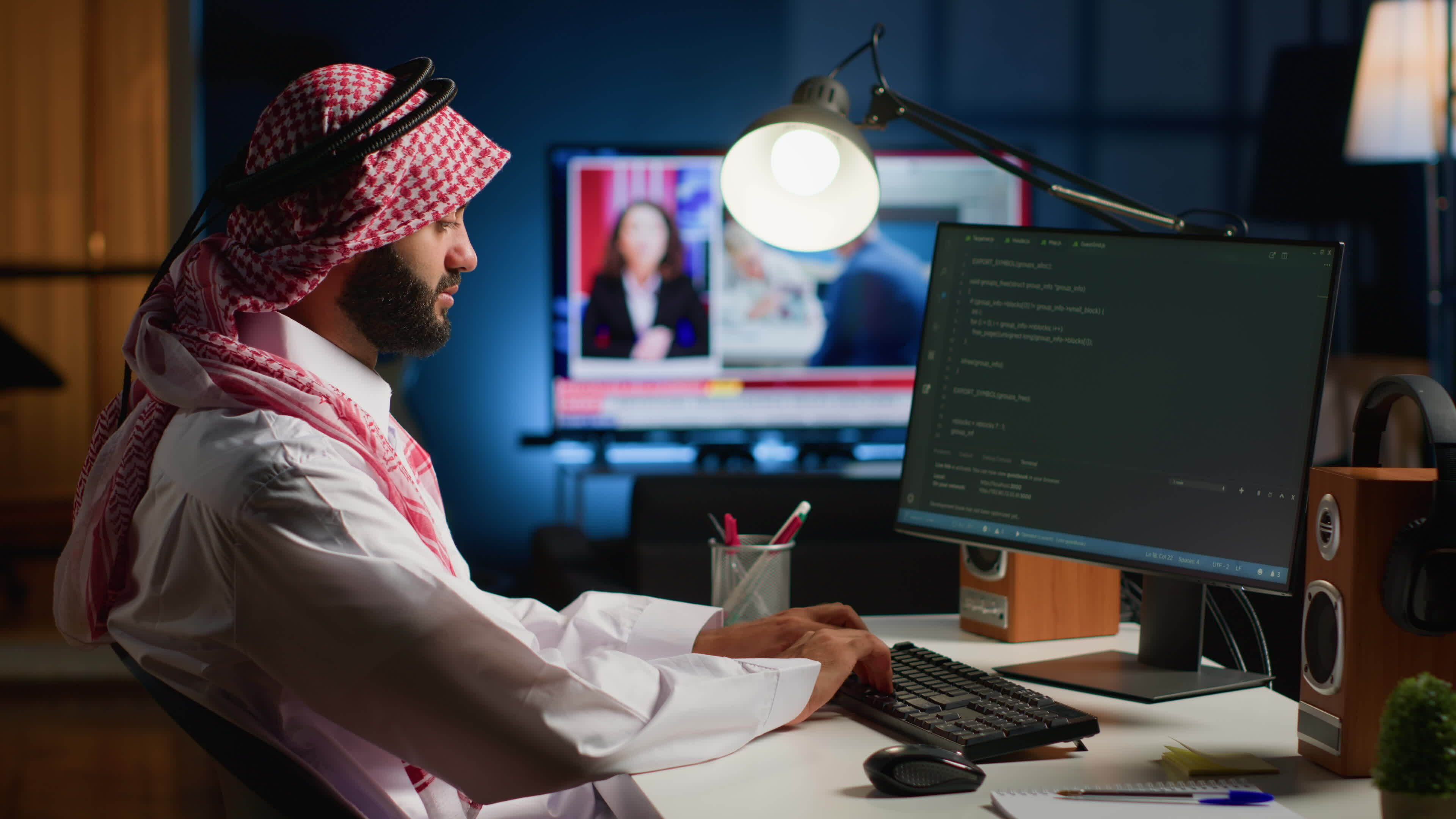Licensed muslim engineer writing code on computer screen while in ... Licensed muslim engineer writing code on computer screen while in ...