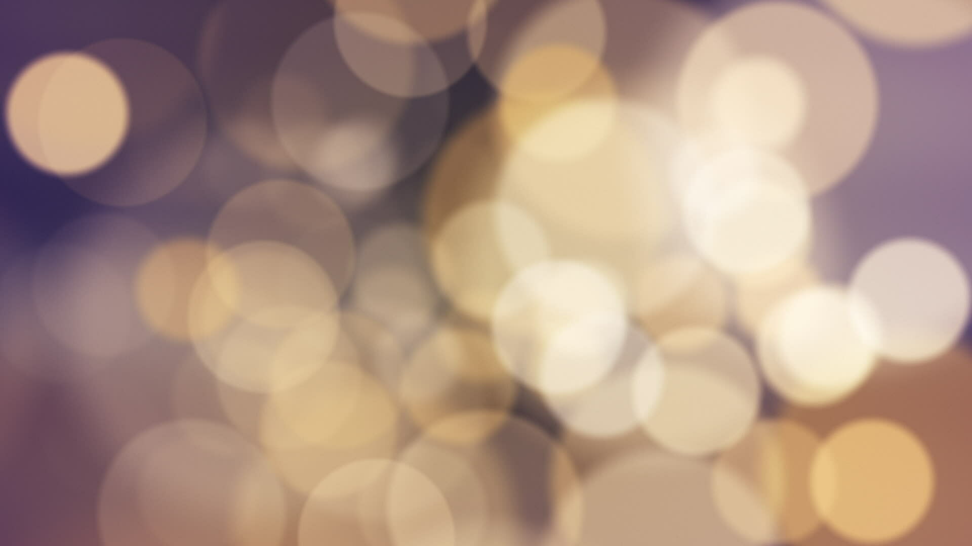 Abstract bokeh background animation with gently flickering defocused warm golden bokeh light ...