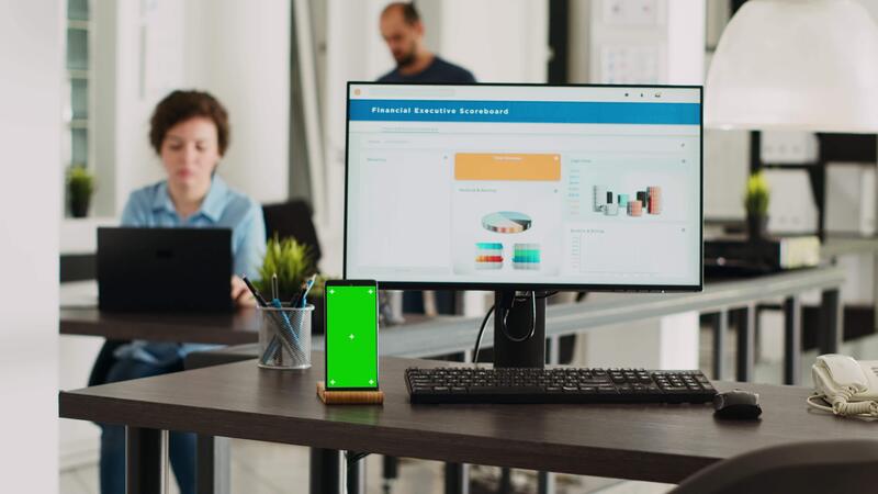 Persons conducting business tasks at agency workspace with cellphone ... Persons conducting business tasks at agency workspace with cellphone ...