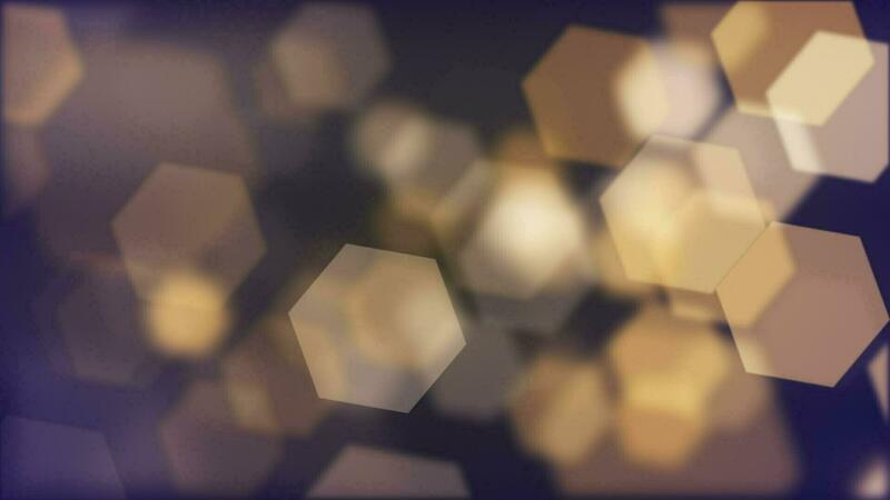 Abstract bokeh background animation with gently flickering defocused warm golden bokeh light ...